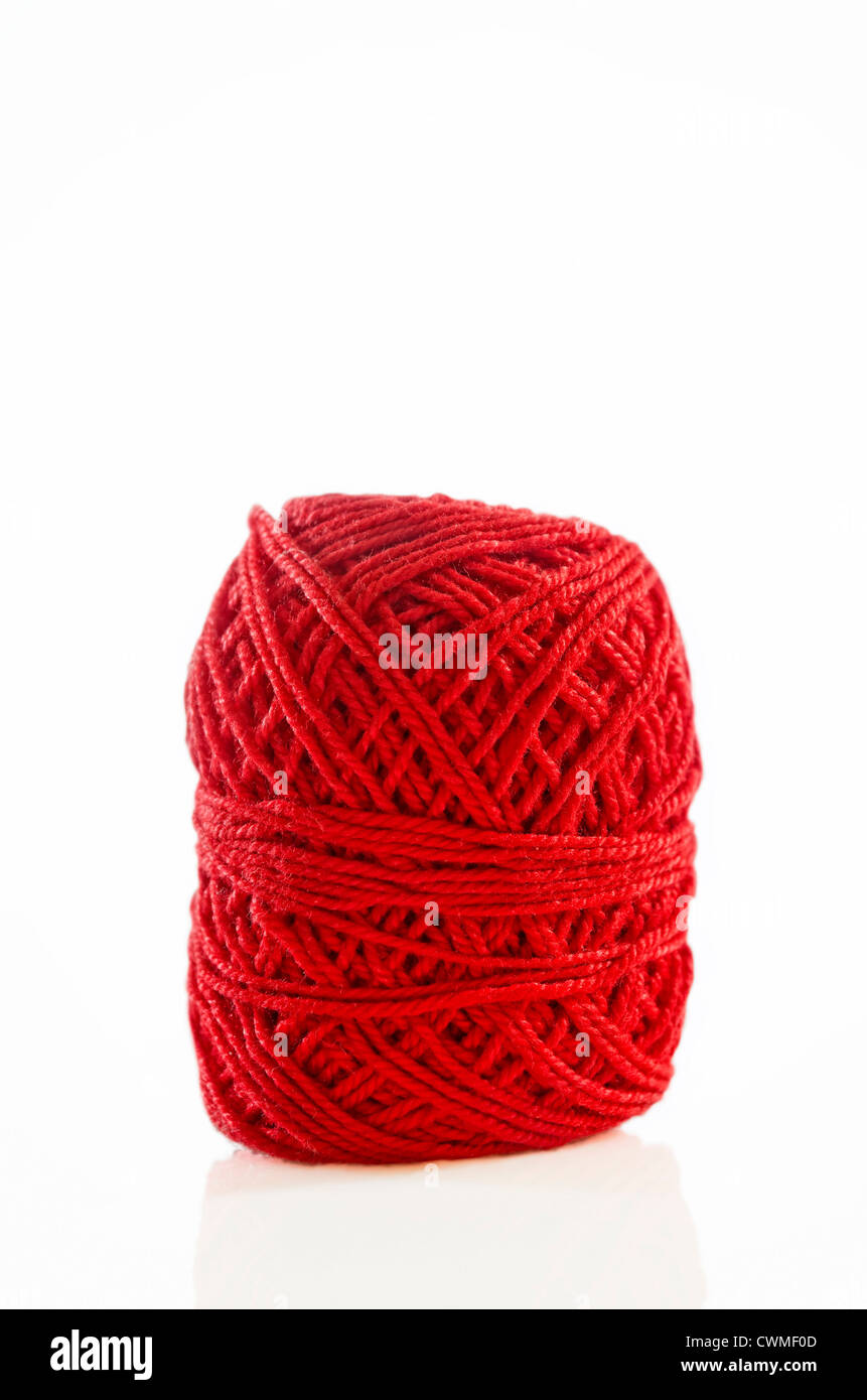 Ball of red cotton thread on white background Stock Photo - Alamy