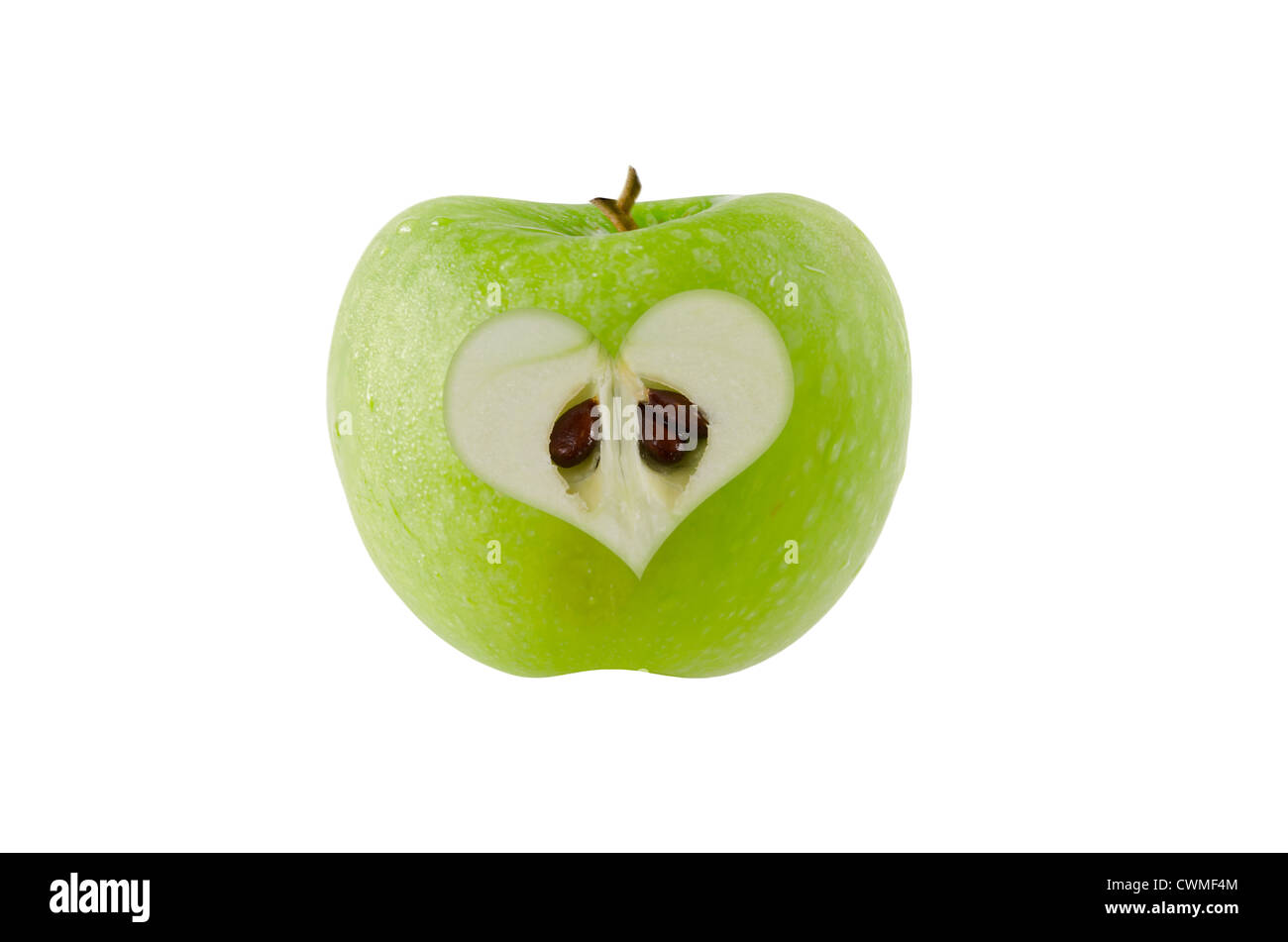 apple with heart shape cut on white background Stock Photo - Alamy