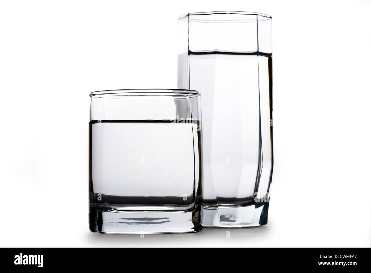 Two glasses of water on white background Stock Photo - Alamy