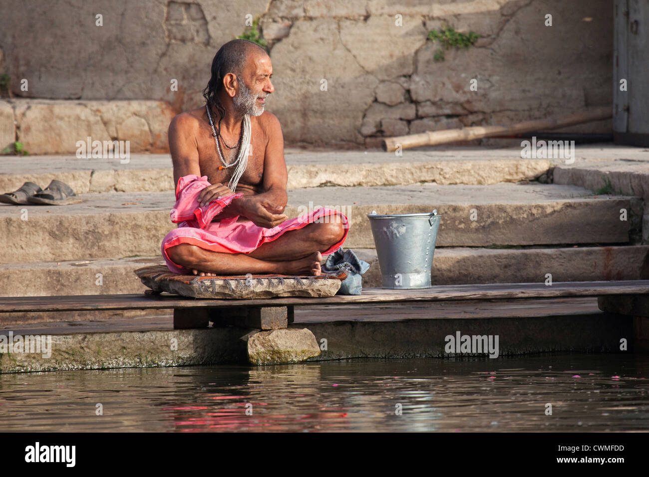 Indian man washing at a ghat along the Ganges river, Varanasi, Uttar ...