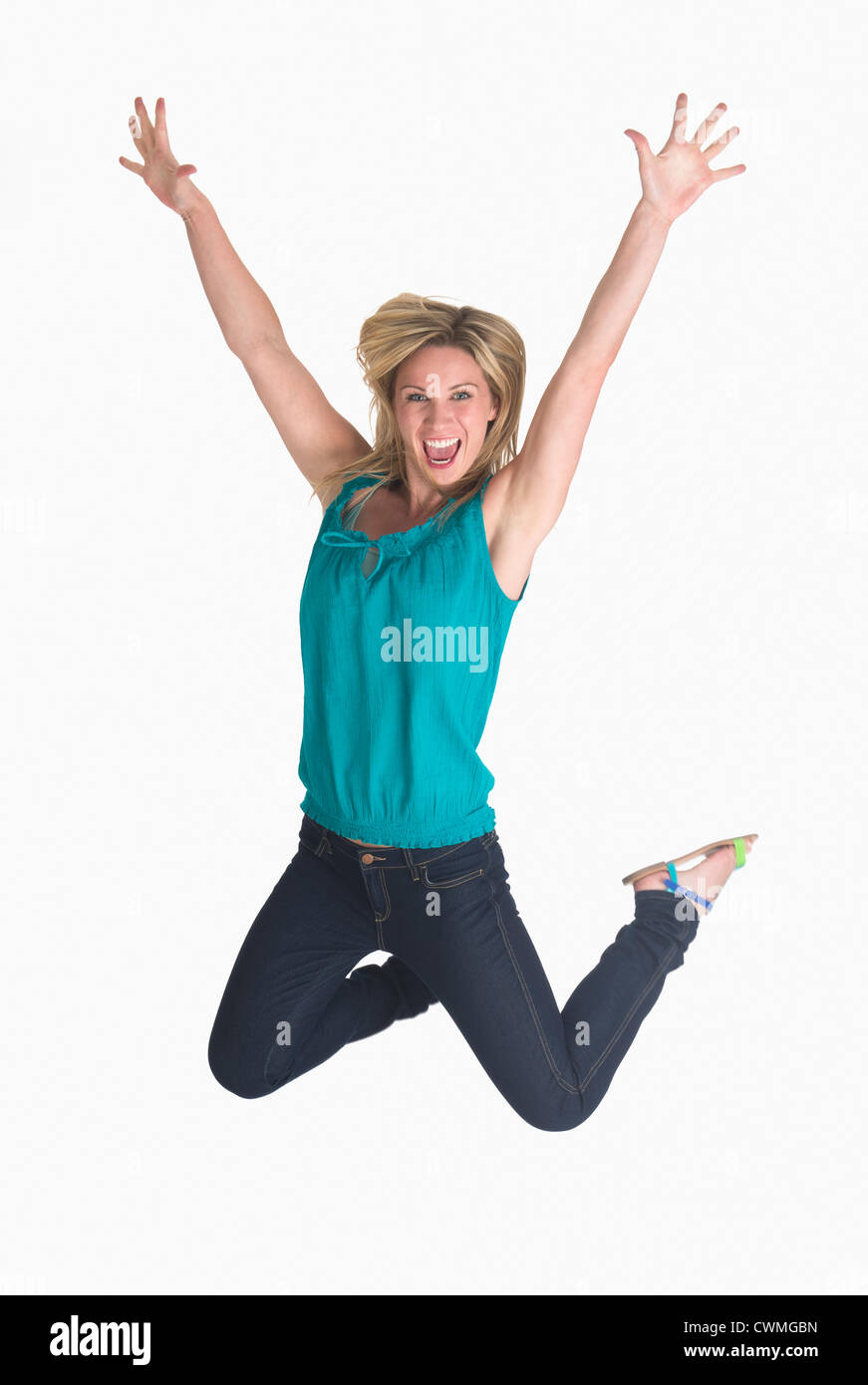 Woman jumping on white background Stock Photo - Alamy