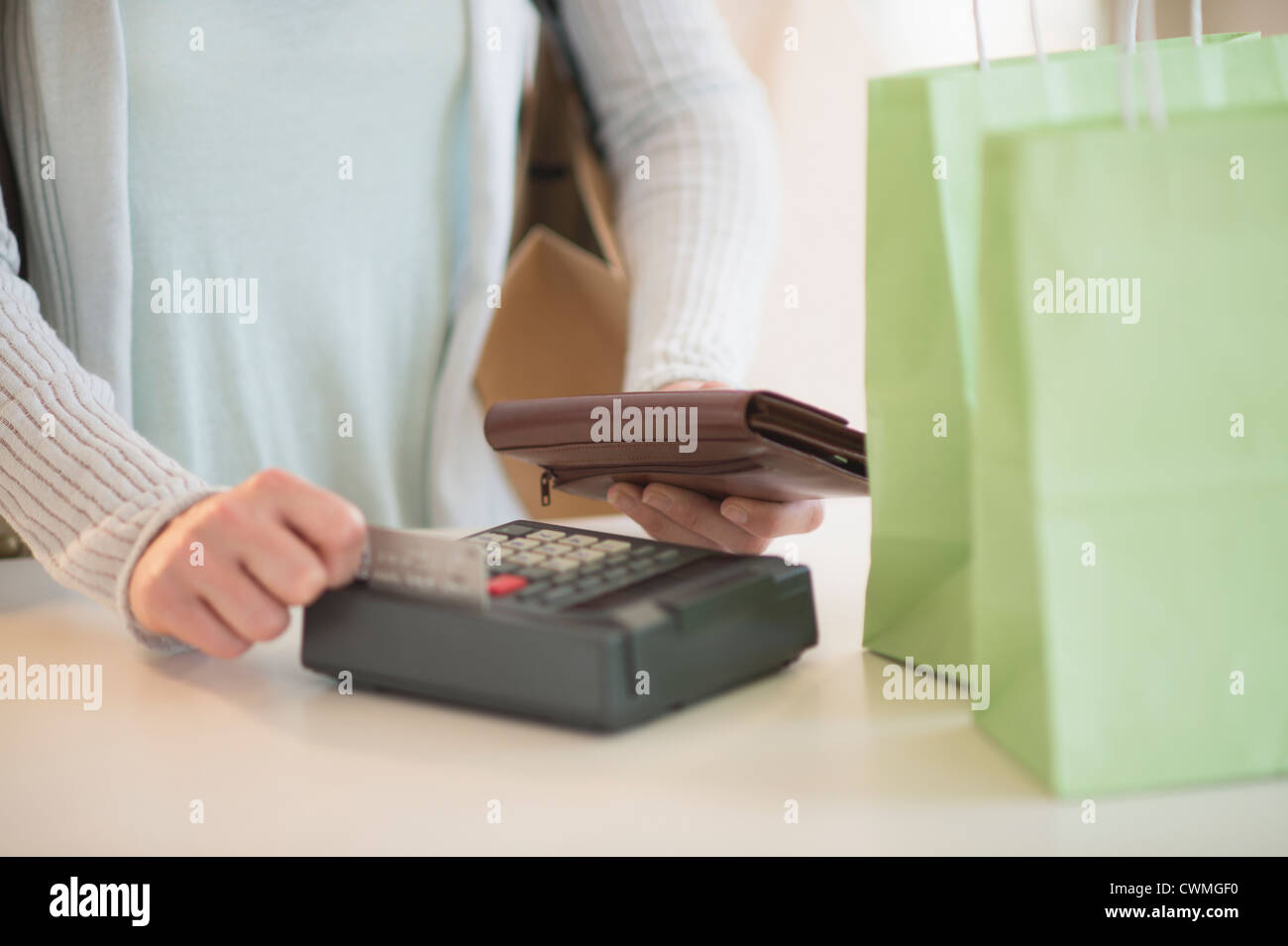 Caucasian woman paying counter hi-res stock photography and images - Alamy