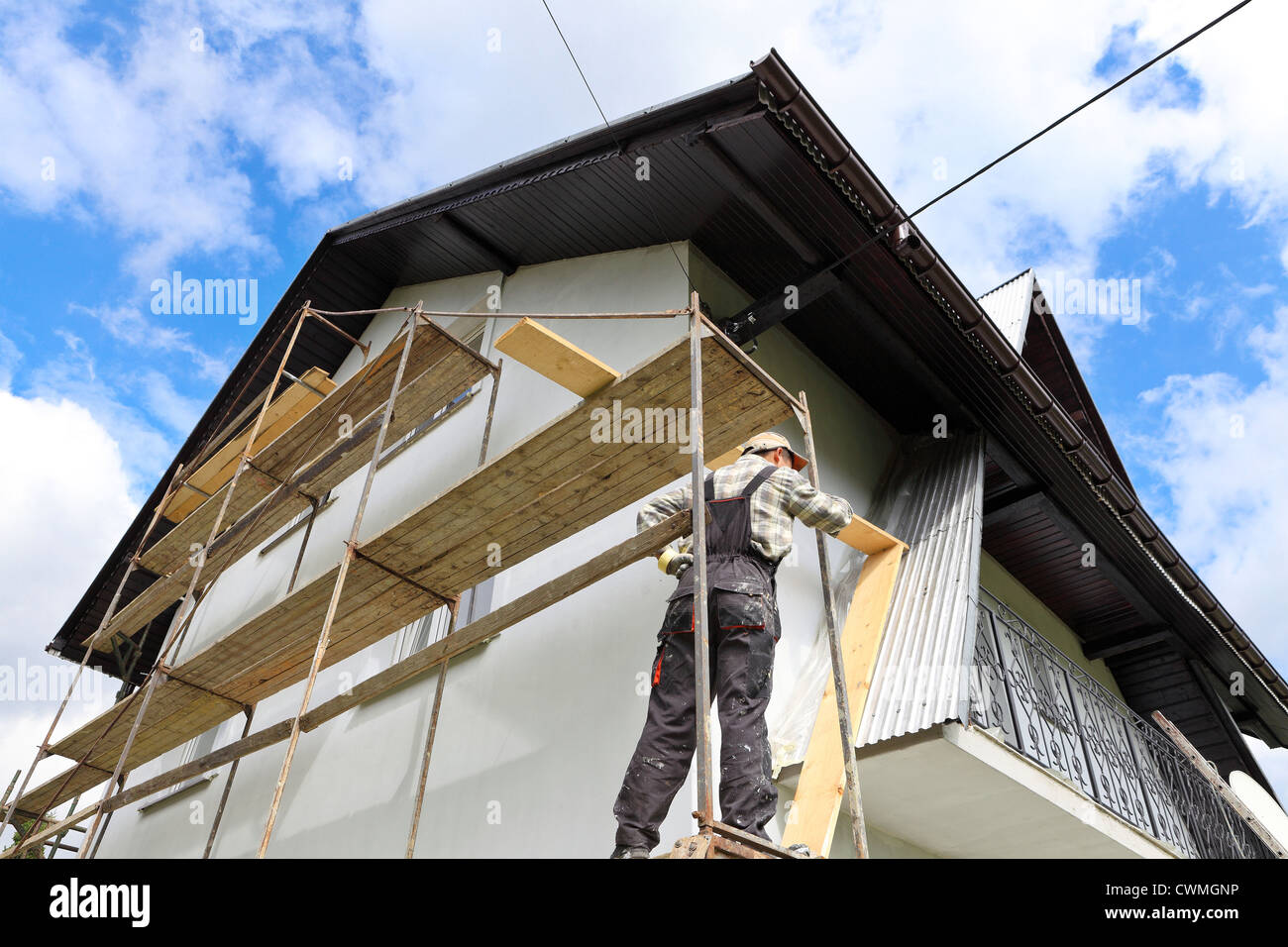 The construction work on the scaffolding Stock Photo - Alamy