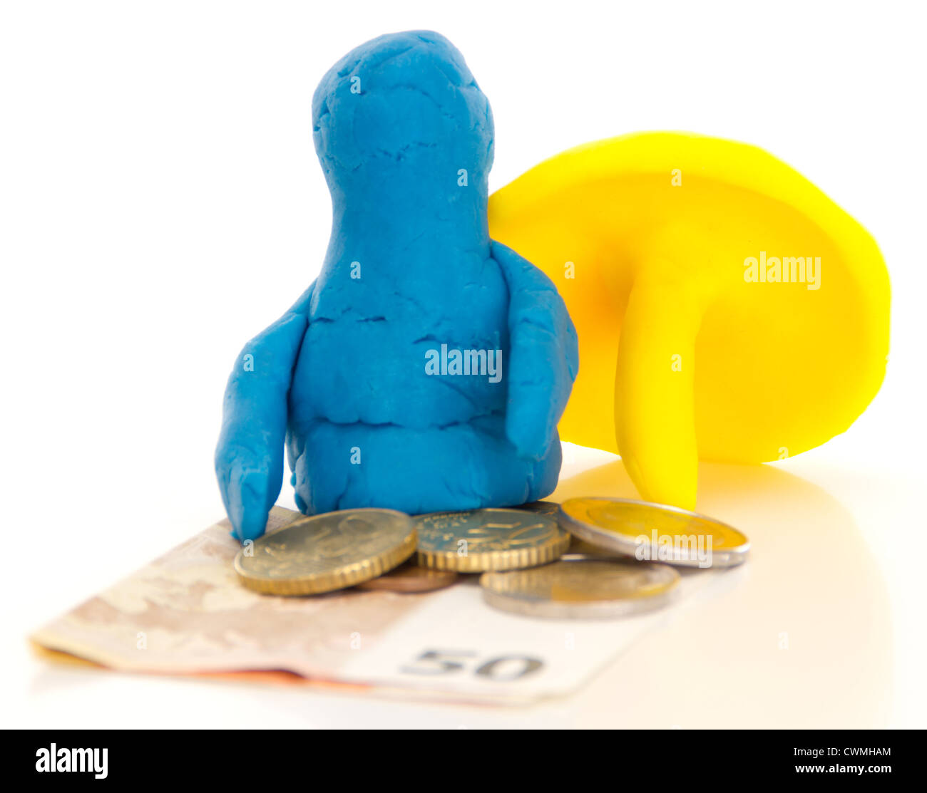 Modelling clay figure with umbrella and money Stock Photo - Alamy