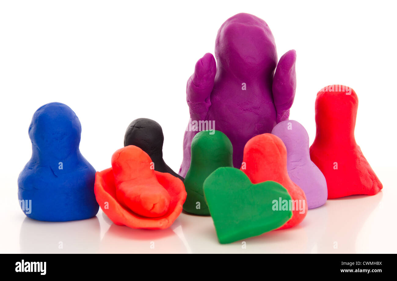 Modelling clay figures with a heart Stock Photo - Alamy