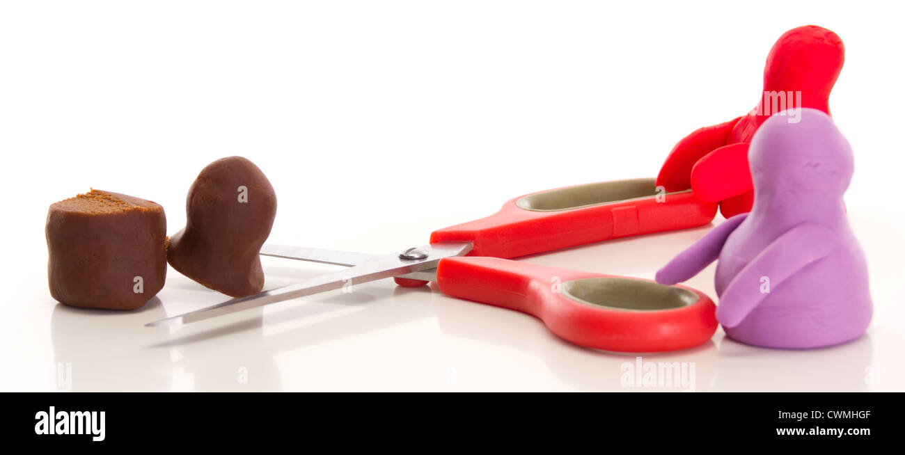 Modelling clay figures with scissors Stock Photo - Alamy