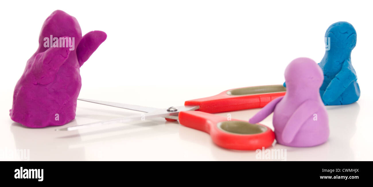 Modelling clay figures with scissors Stock Photo - Alamy