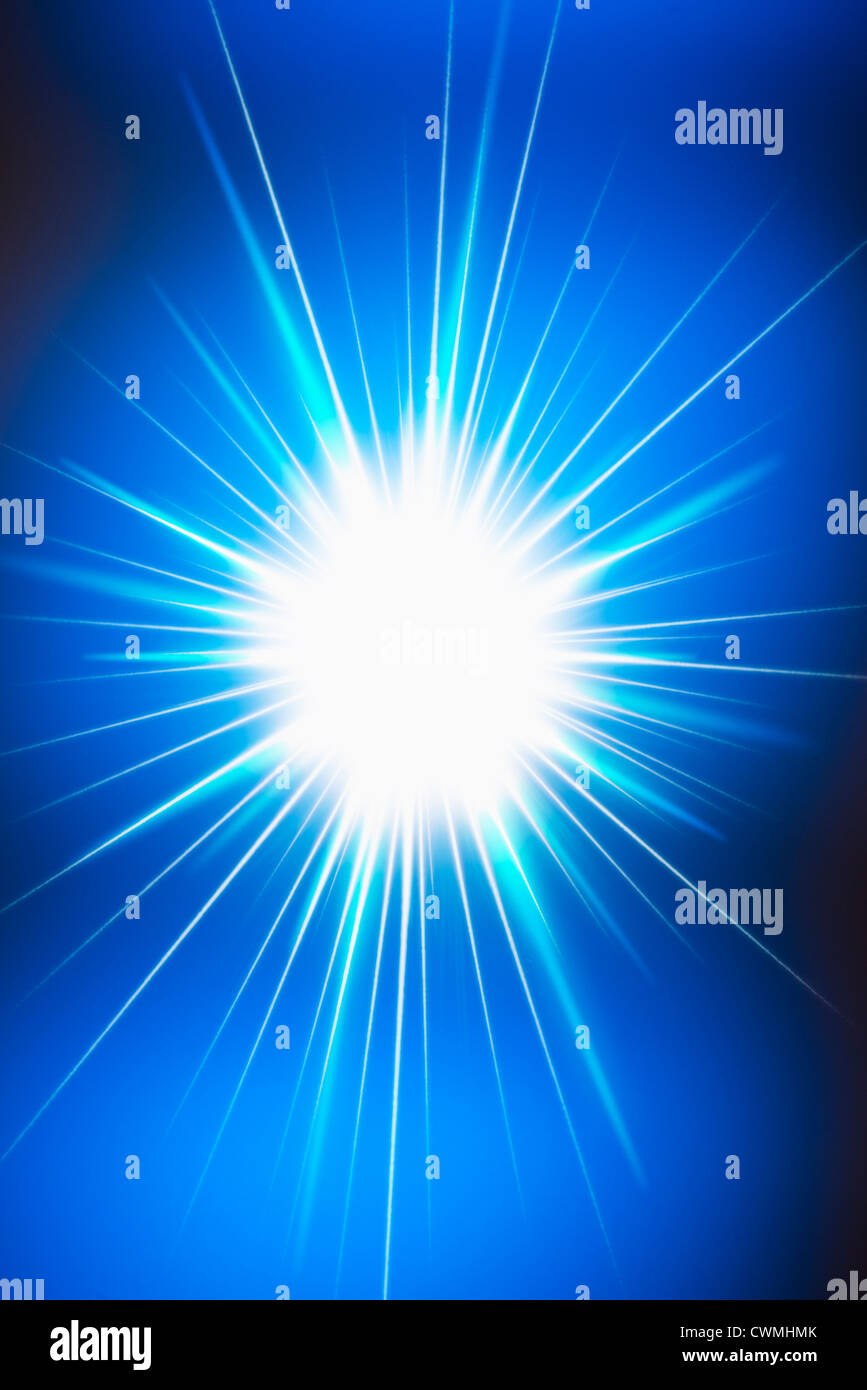 Glowing star on blue Stock Photo - Alamy