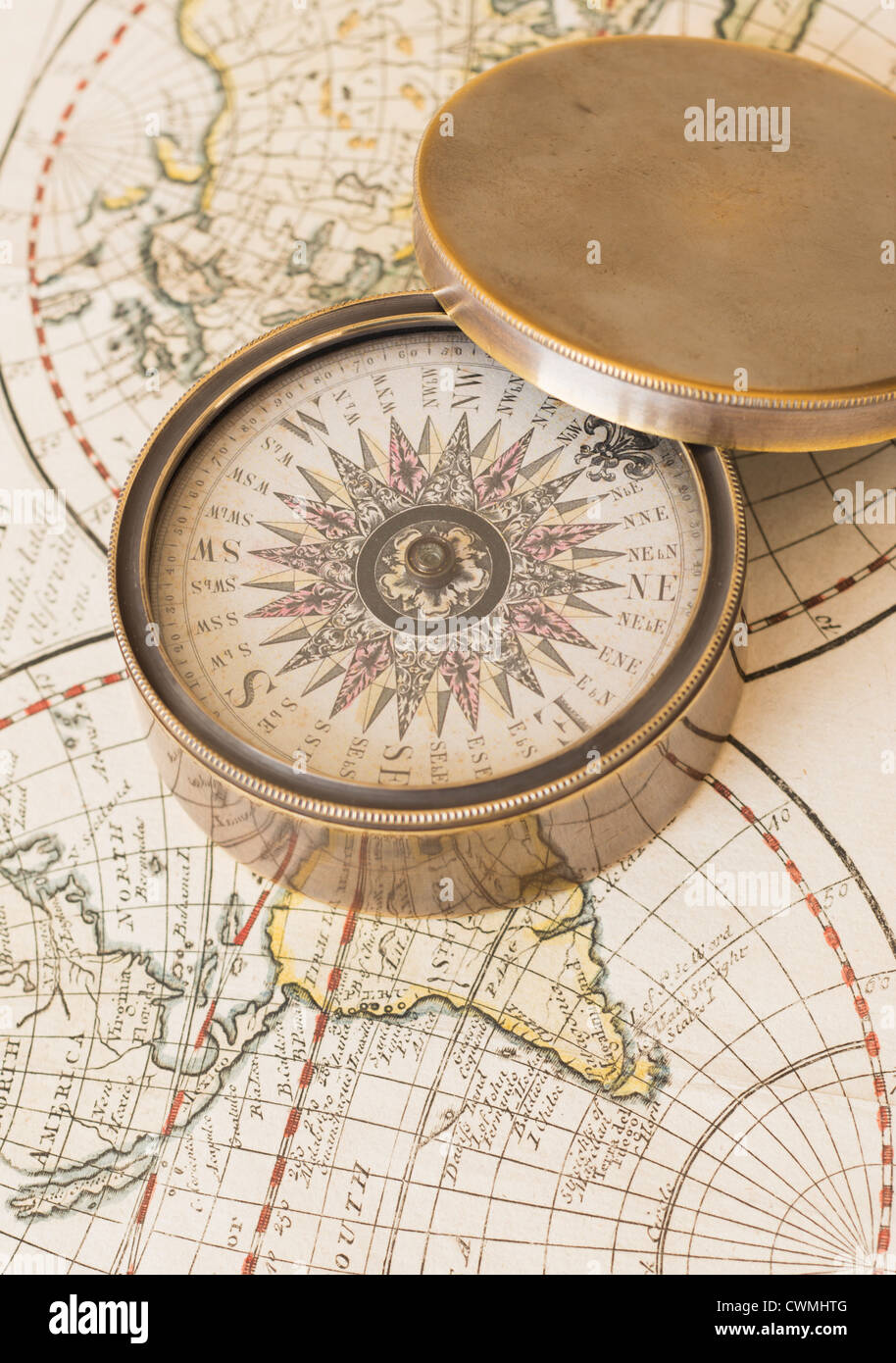 Compass and antique map Stock Photo - Alamy