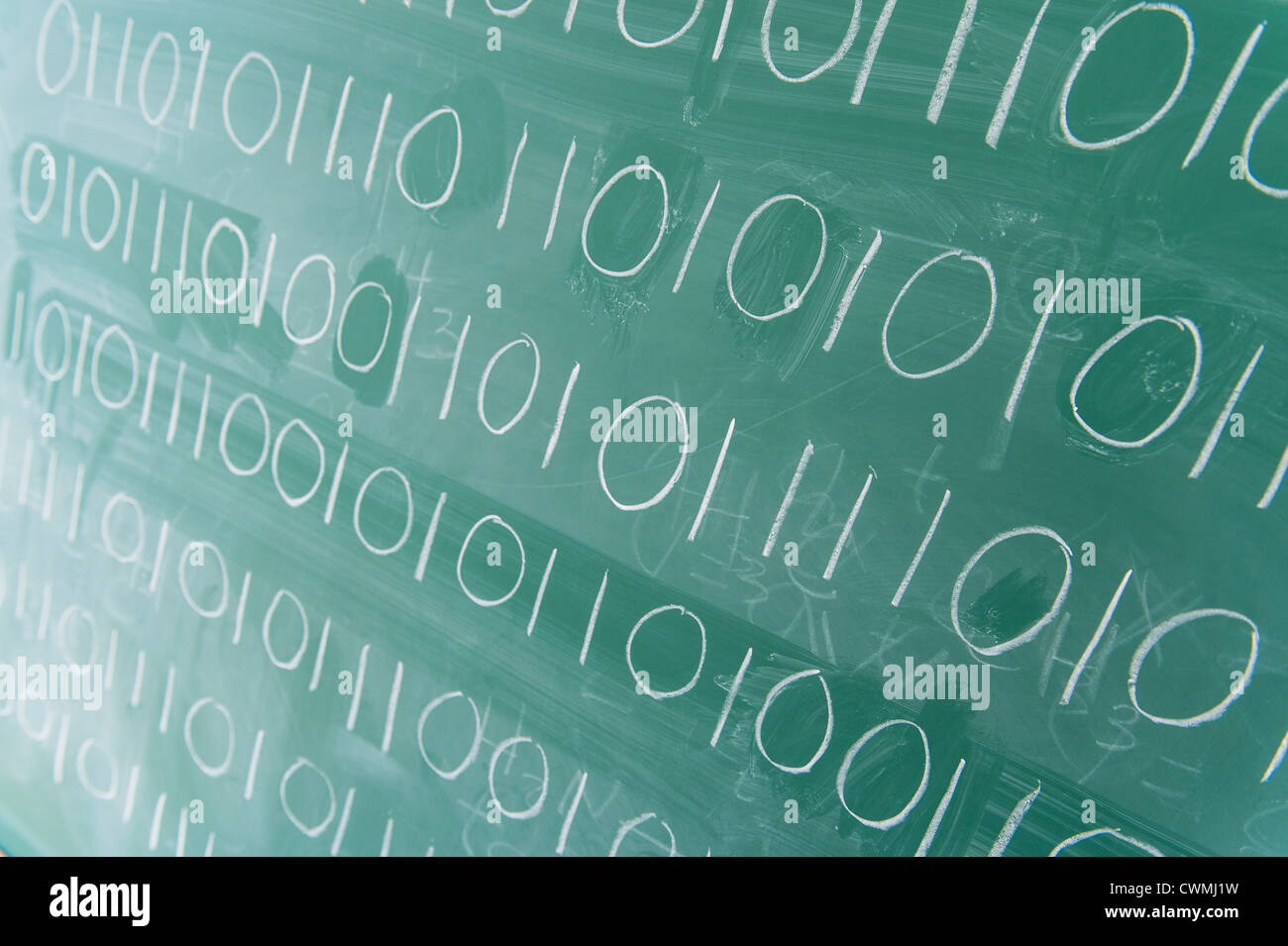 Binary code on blackboard Stock Photo - Alamy