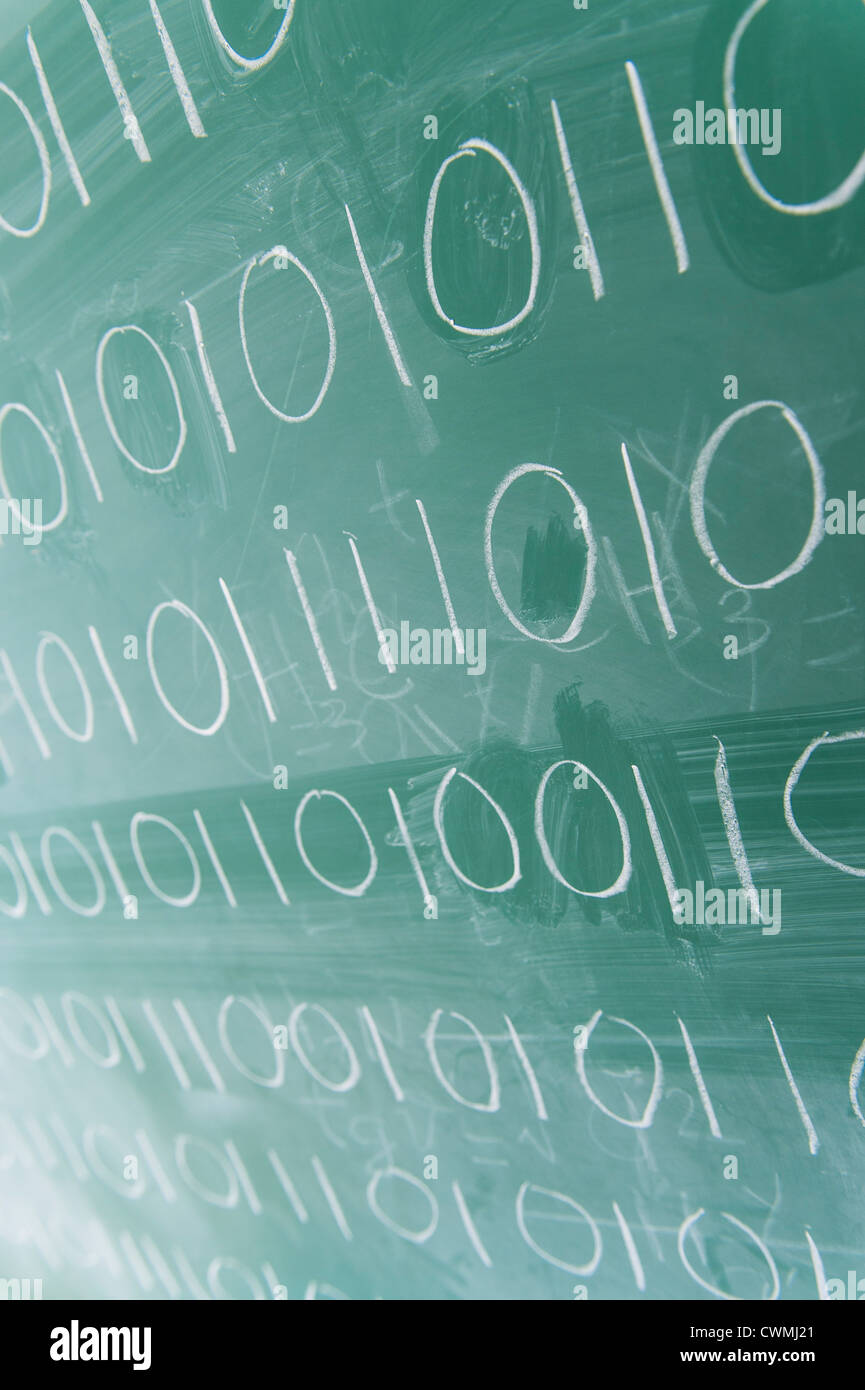 Binary code on blackboard Stock Photo - Alamy