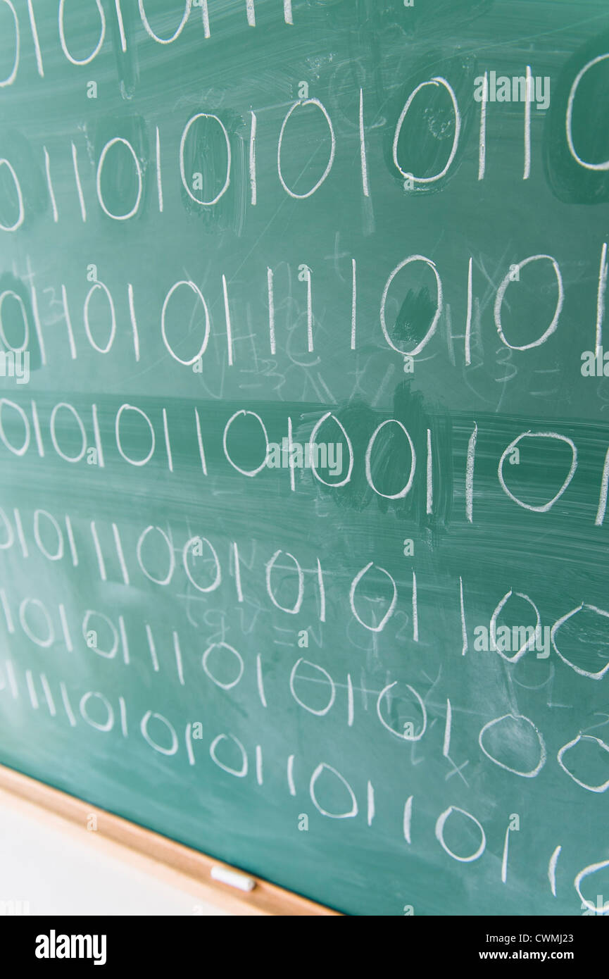 Binary code on blackboard Stock Photo - Alamy