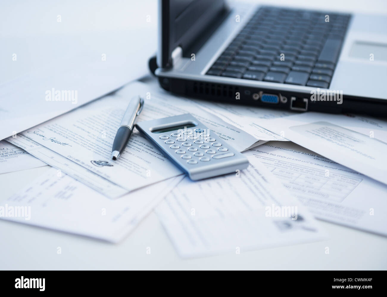 Pen, calculator and laptop Stock Photo - Alamy
