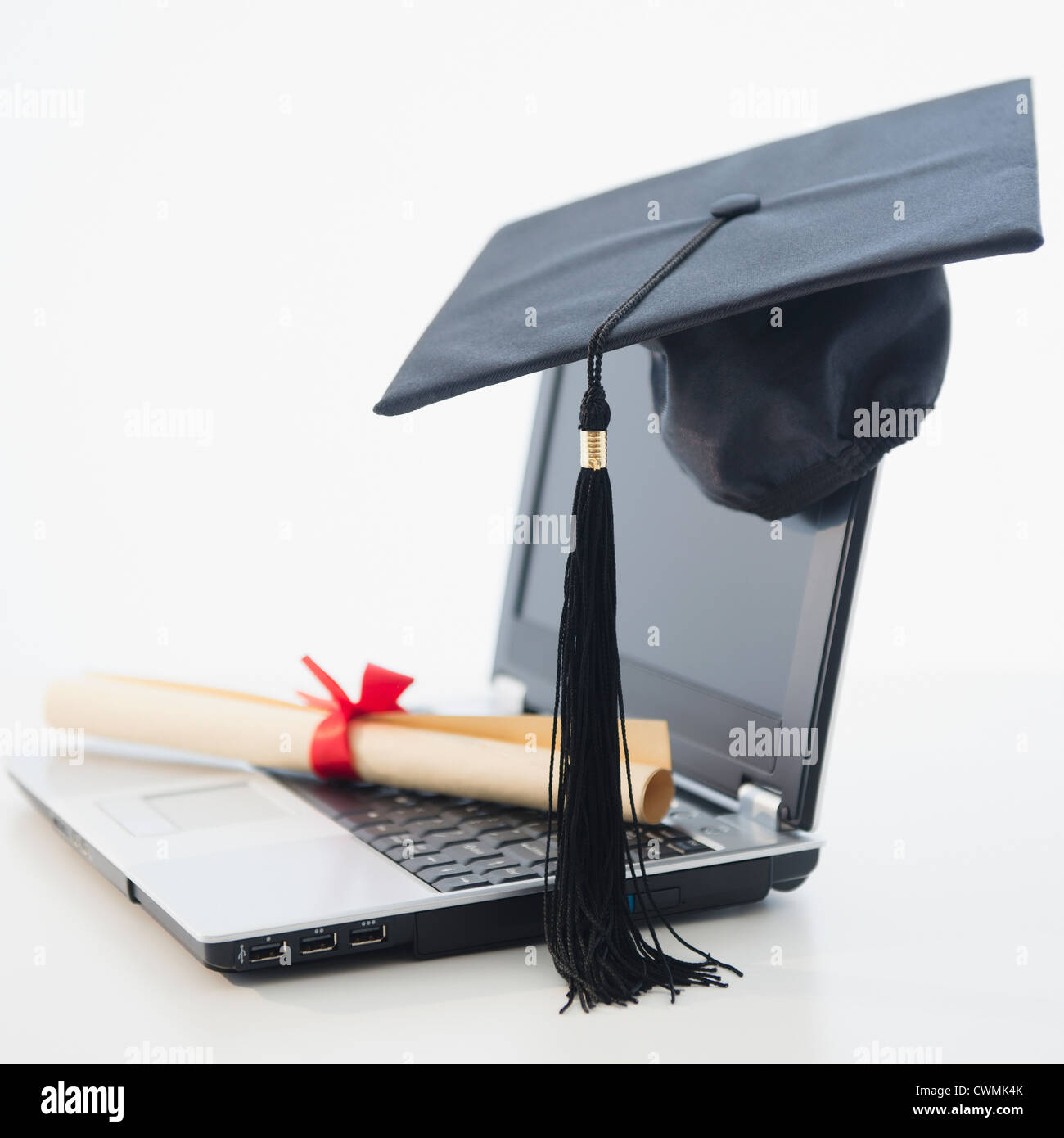 Laptop with diploma and mortar board Stock Photo - Alamy