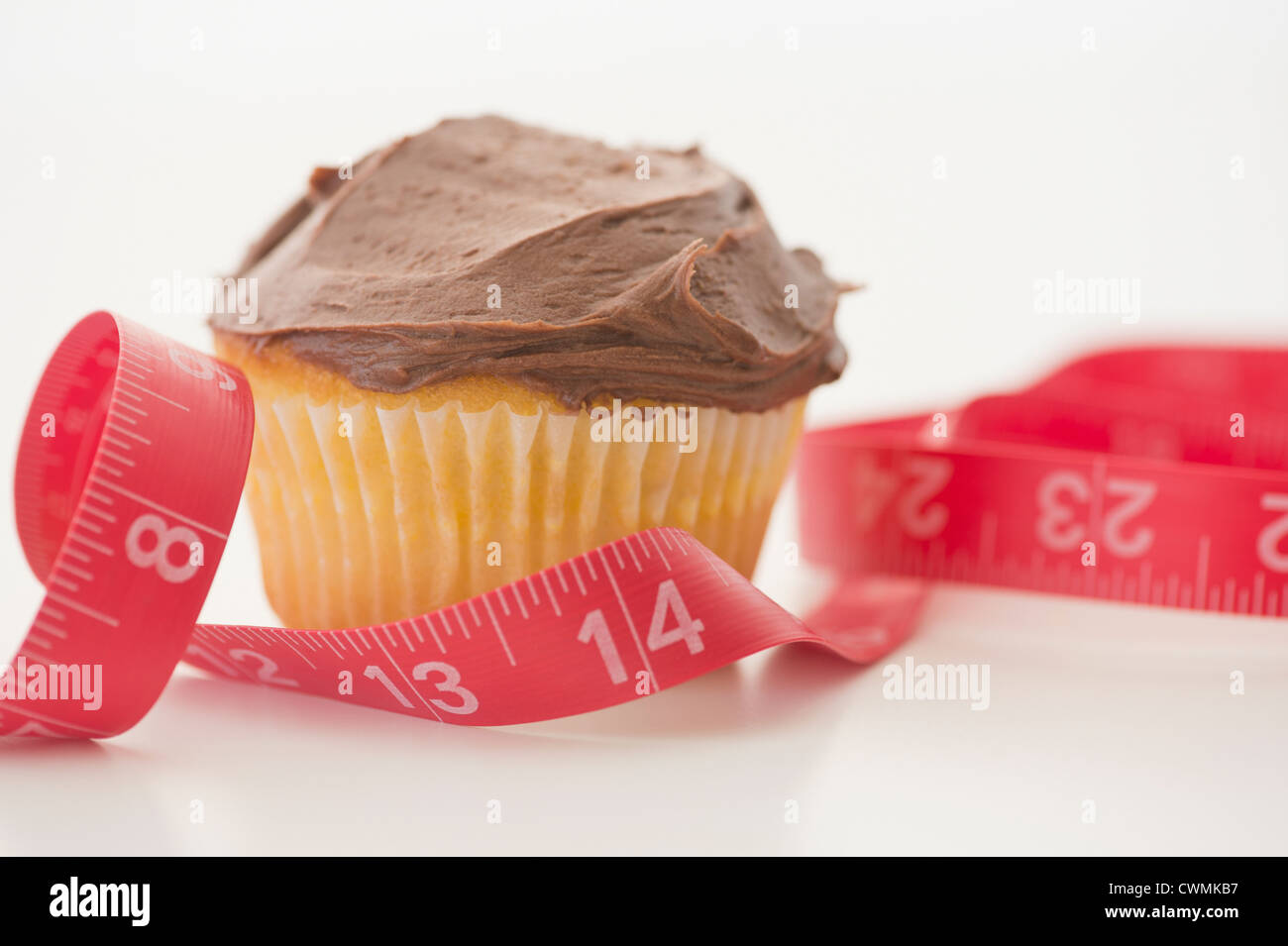 Studio Shot of cupcake and tape measure Stock Photo - Alamy