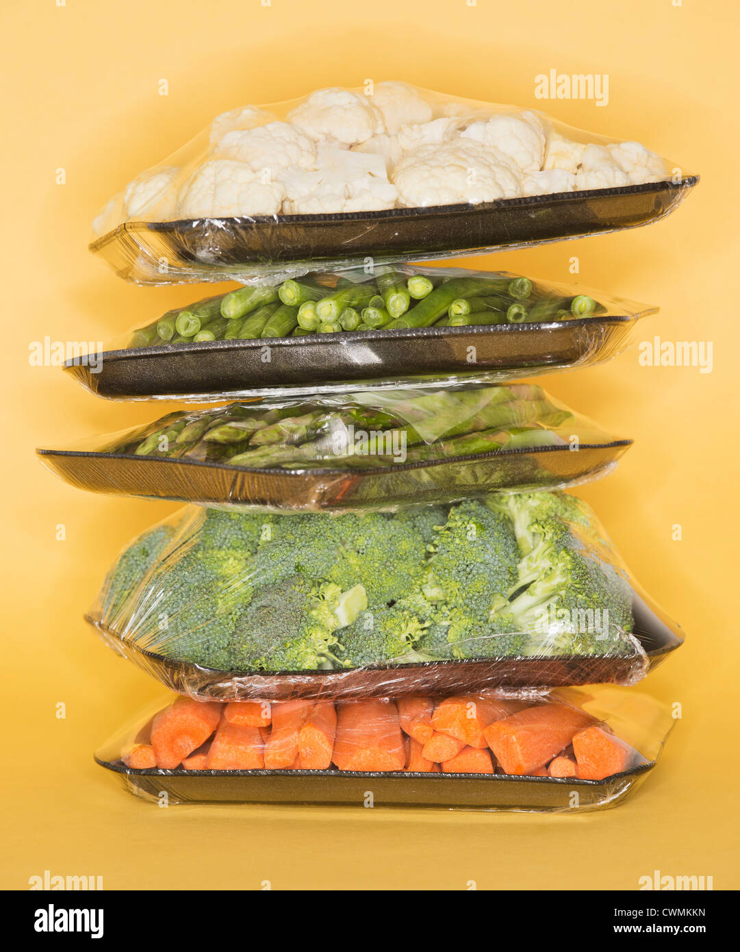 Studio shot of vegetables wrapped on trays Stock Photo - Alamy