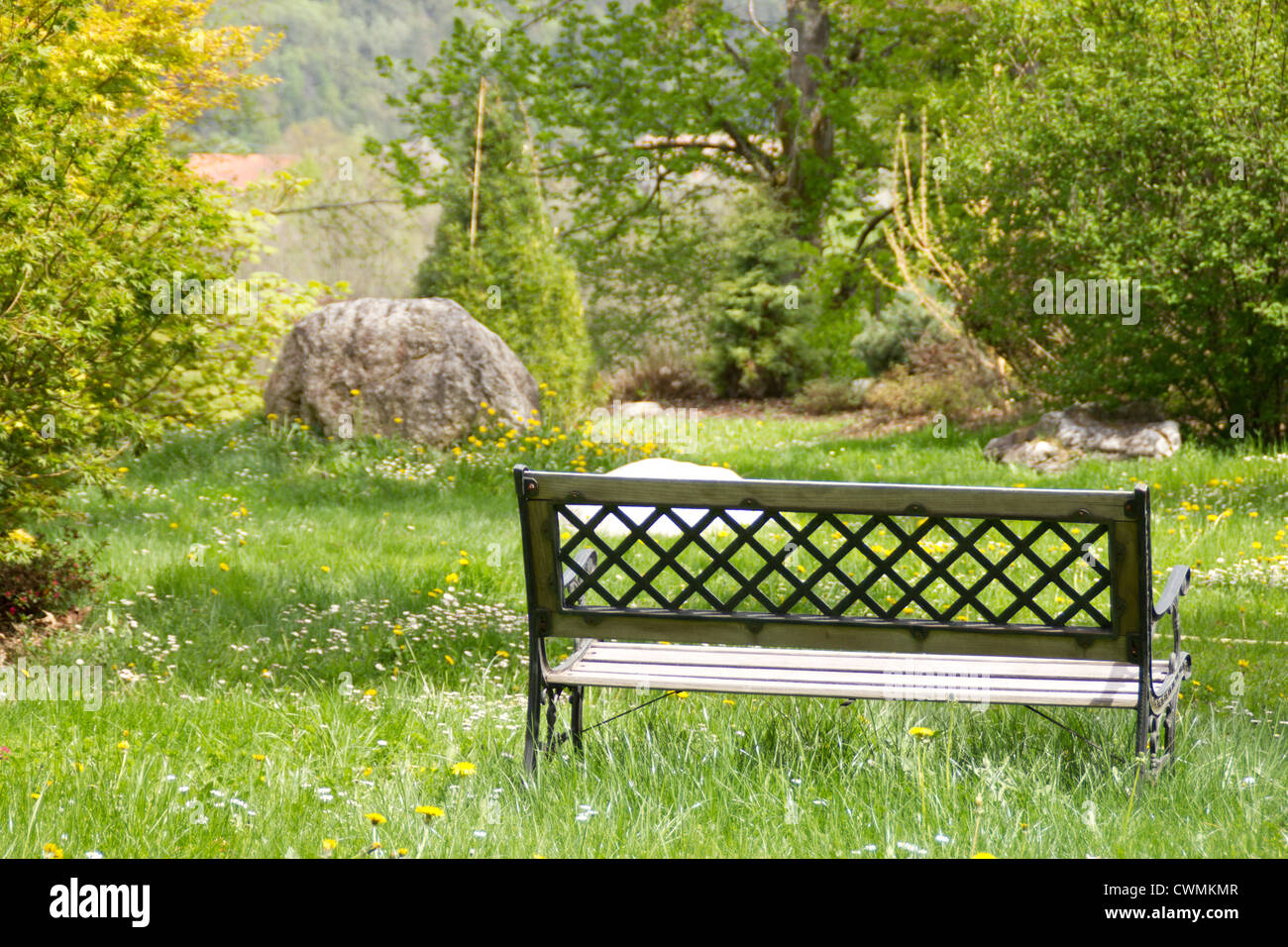 Lonely bench standing in a park Stock Photo - Alamy