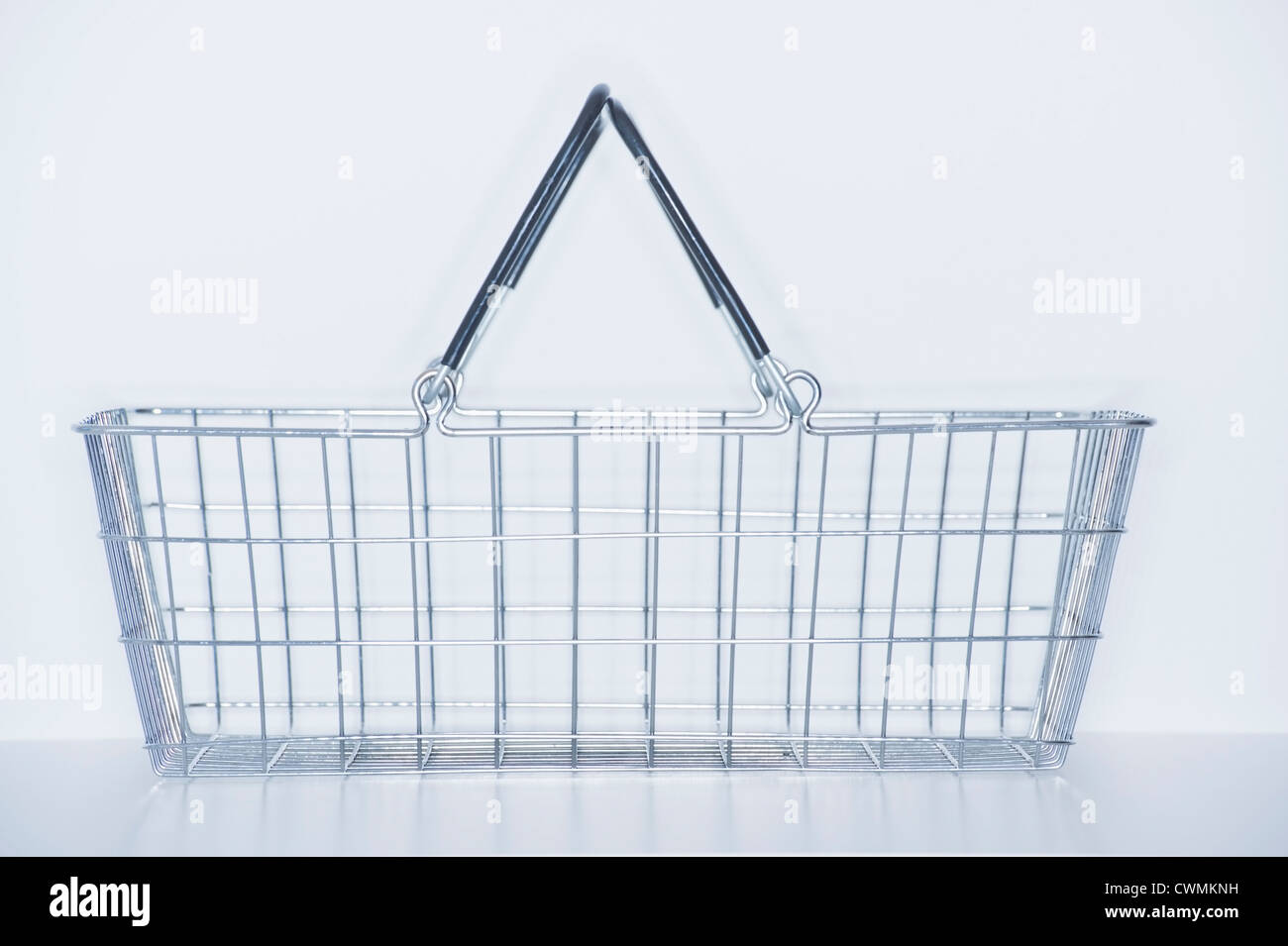 Studio shot of shopping basket Stock Photo - Alamy
