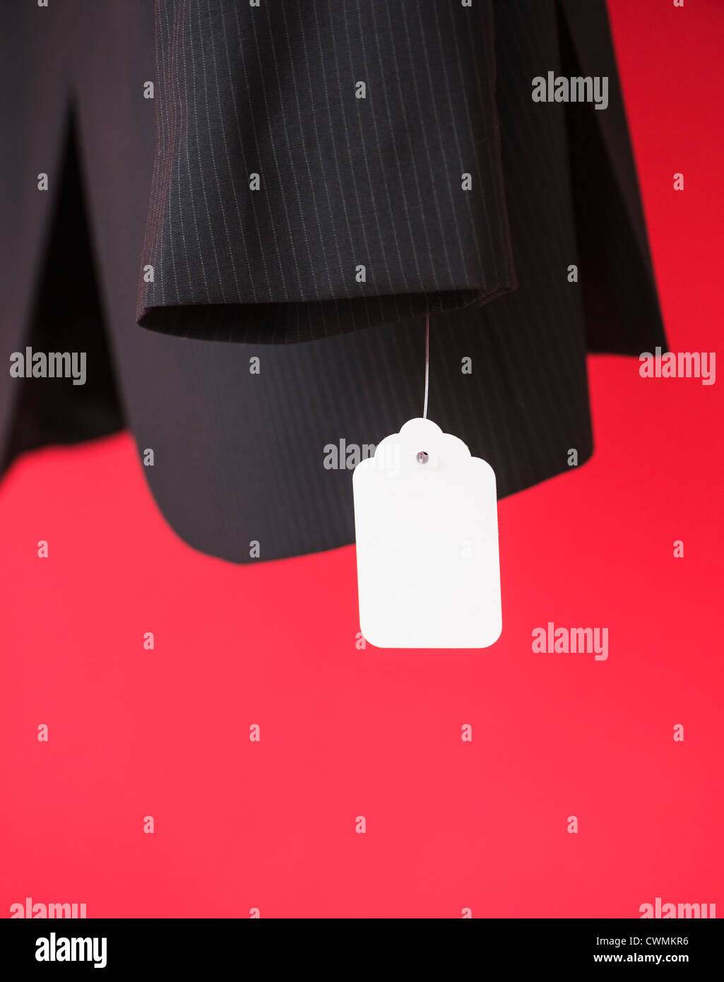 Studio shot of suit with price tag Stock Photo - Alamy