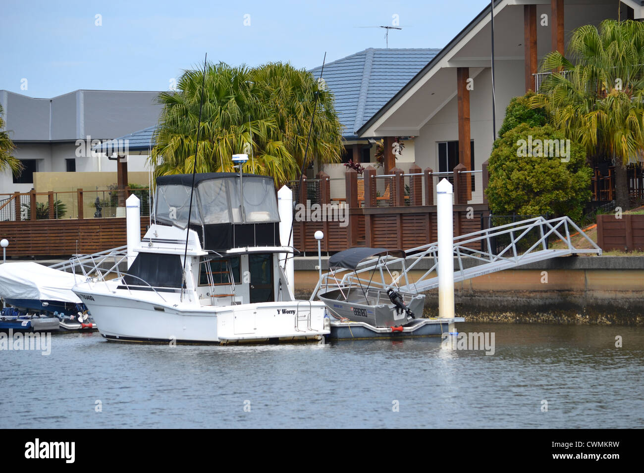 Fishing boat docked at pontoon Bribie island canals Stock Photo - Alamy