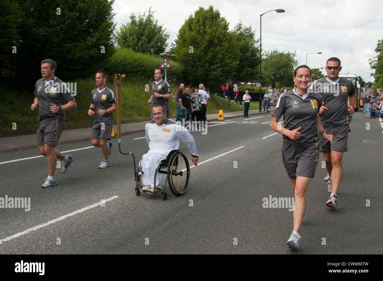 Brian Alldis carrying the Olympic torch in Bury St Edmunds Stock Photo ...