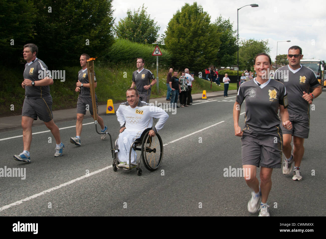 Brian Alldis carrying the Olympic torch in Bury St Edmunds Stock Photo ...