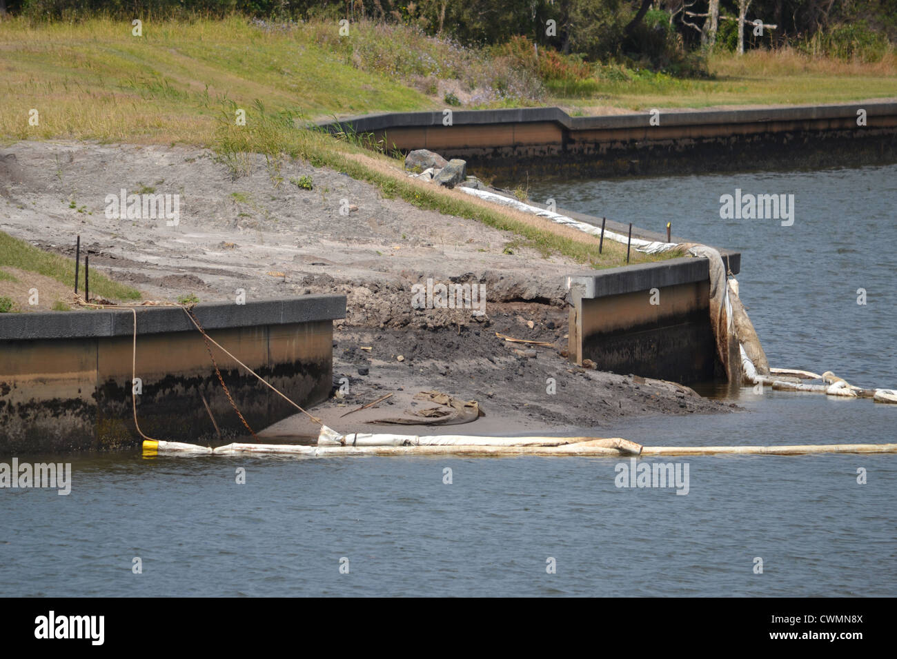 Collapsed section of canal wall Stock Photo - Alamy