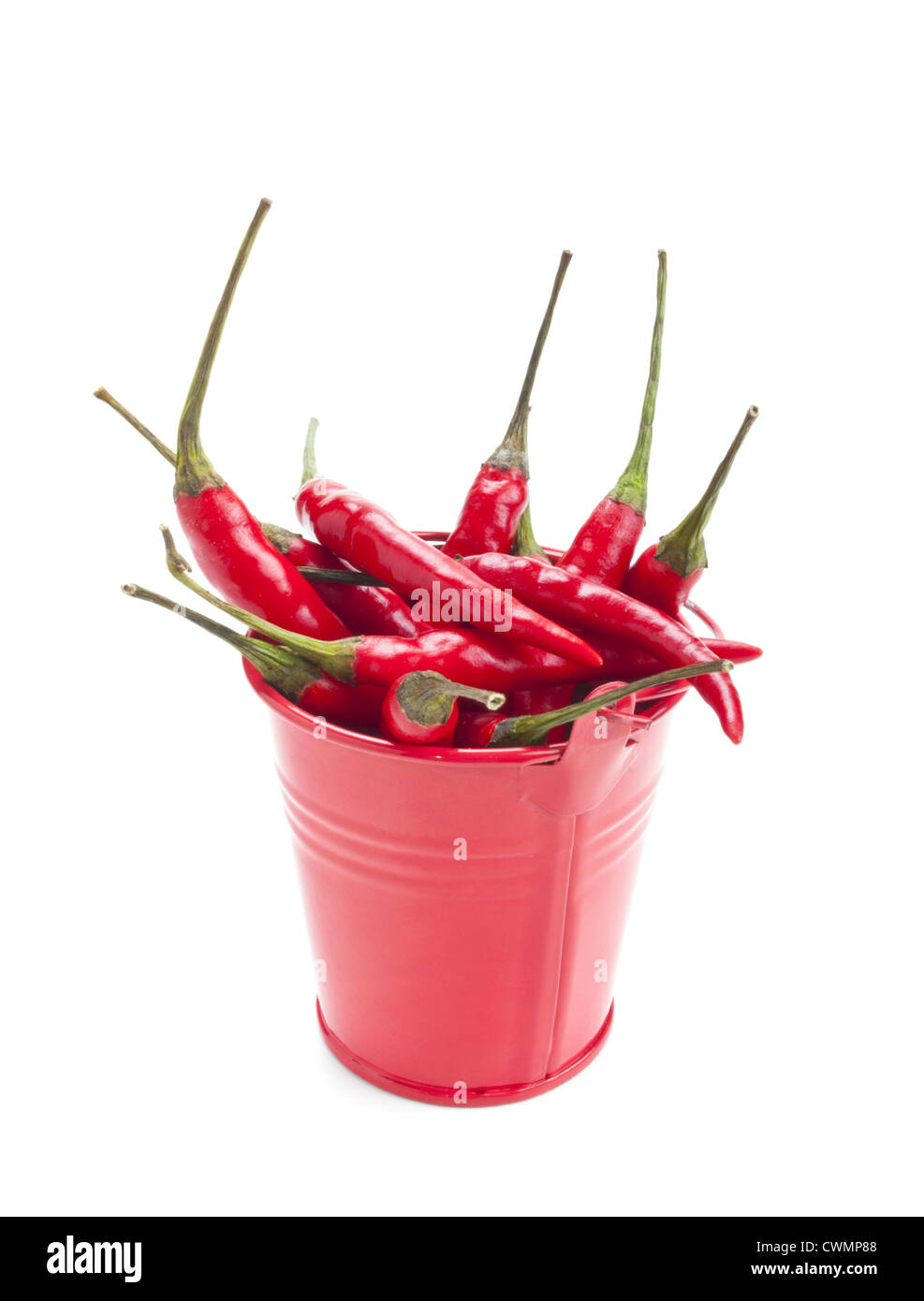 A bucket full of red chili peppers isolated on white Stock Photo - Alamy