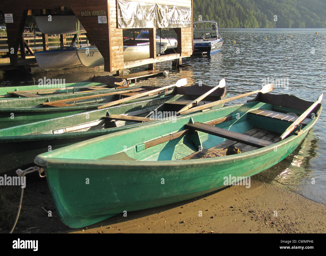 Rowing boats on sandy beach of Lake Millstatt, beside Camping Brunner ...