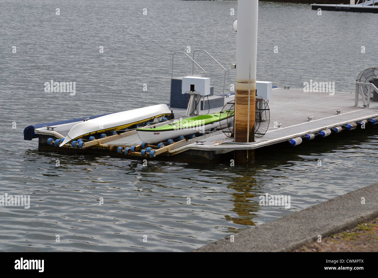 canal pontoon with kayaks Stock Photo - Alamy