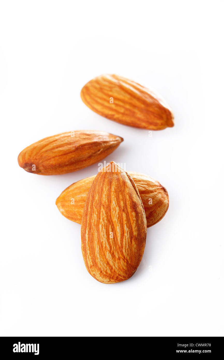 Almonds on a white background Stock Photo - Alamy