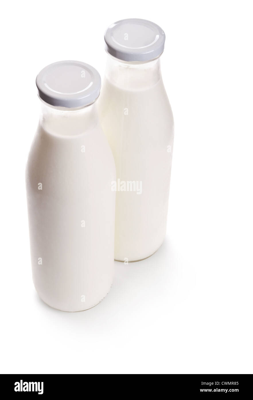 two milk bottles isolated on white background Stock Photo - Alamy