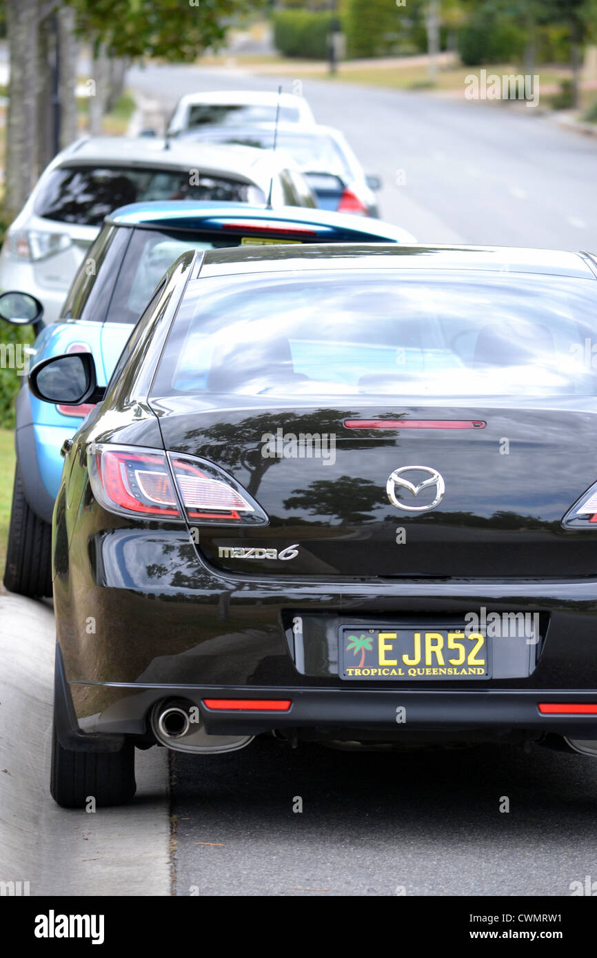 behind view of a black mazda 6 in the sunshine Stock Photo - Alamy