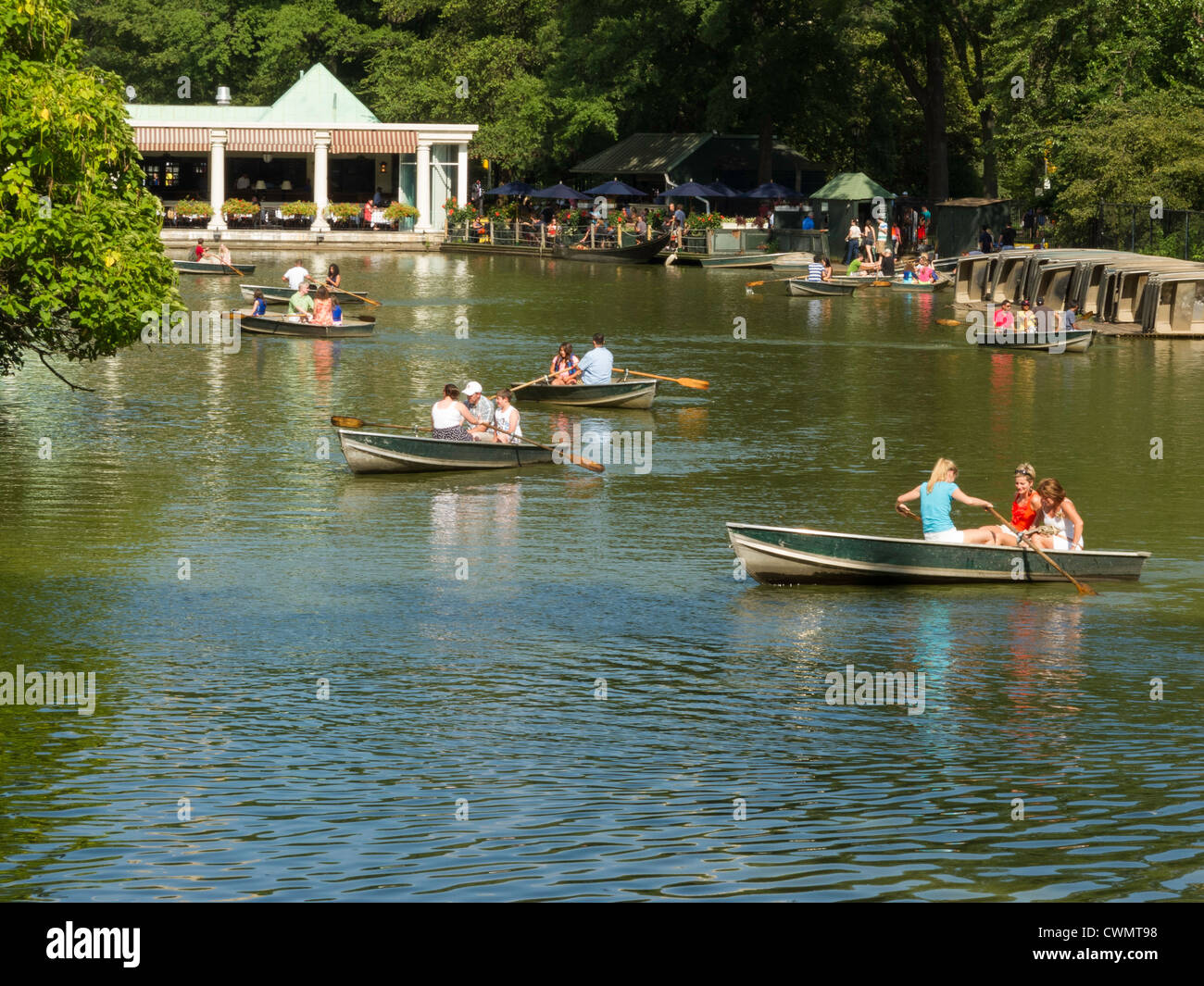 Rowboats on the The Lake in Central Park with Loeb Boathouse in the ...