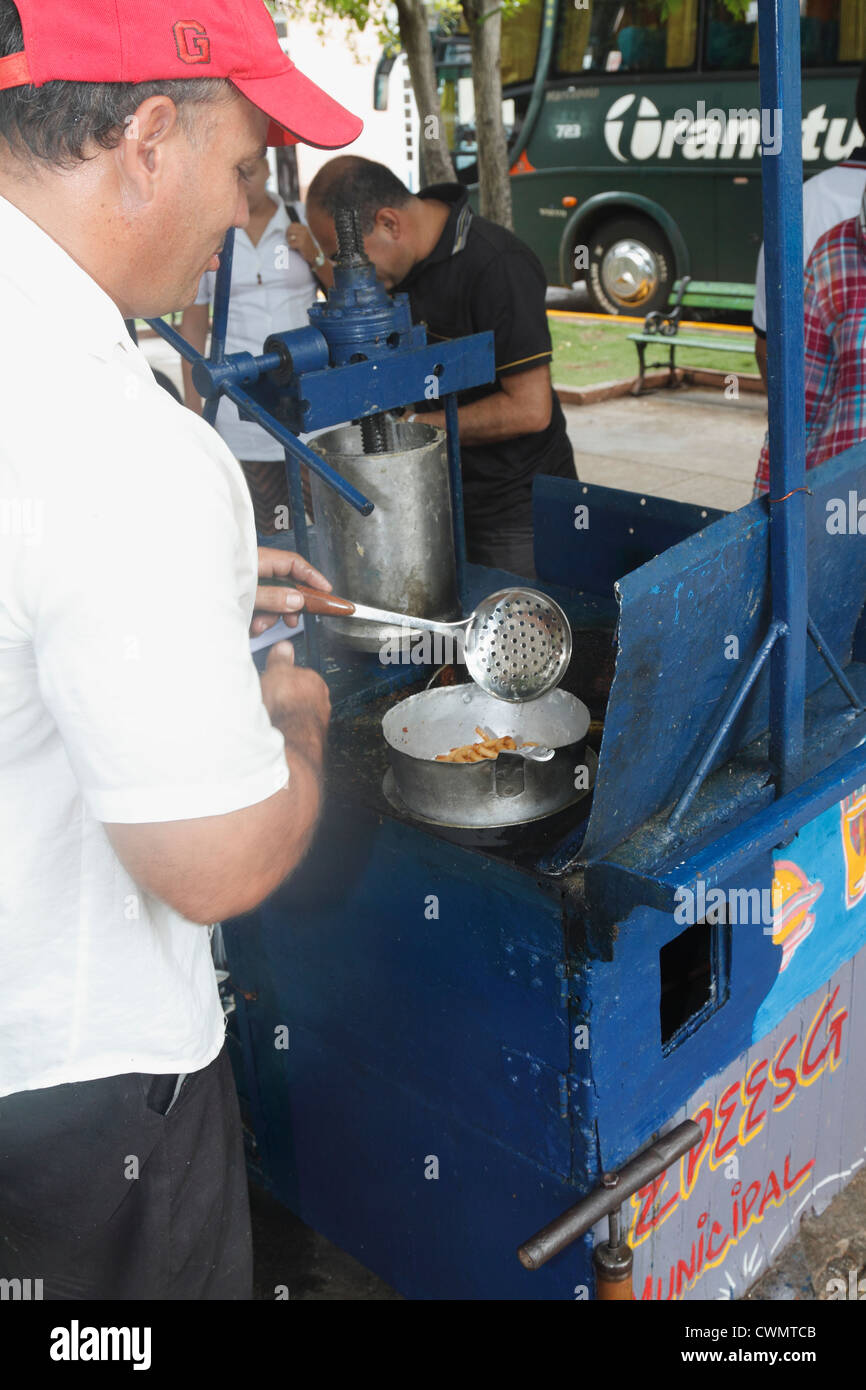 Churro / churros (Spanish donut) Cook (street vendor (selling) on the ...