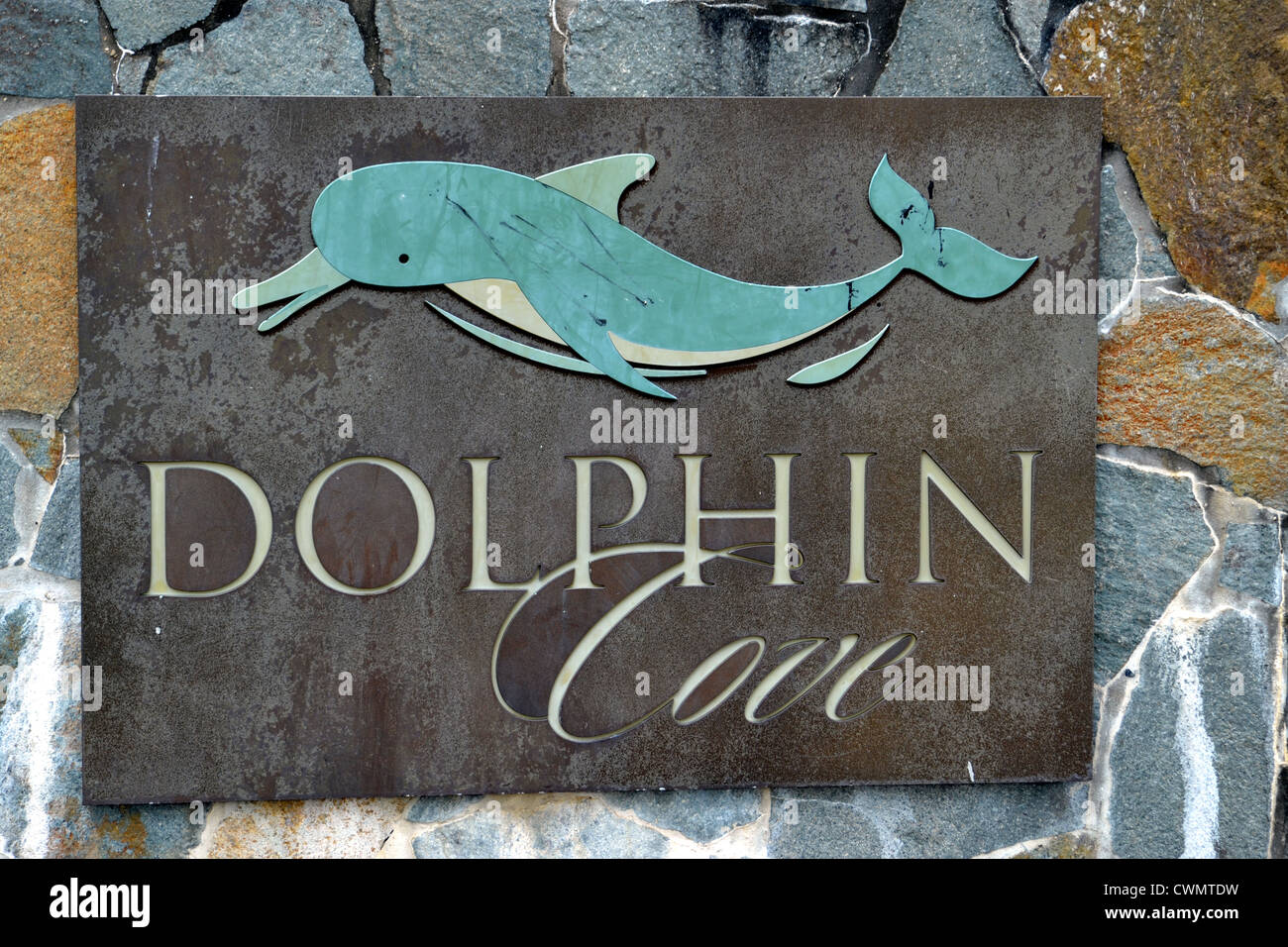 Dolphin Cove entry sign Stock Photo - Alamy