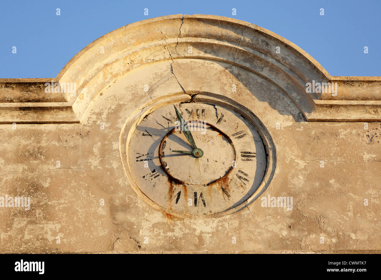 old damaged and rusty stone clock Stock Photo - Alamy