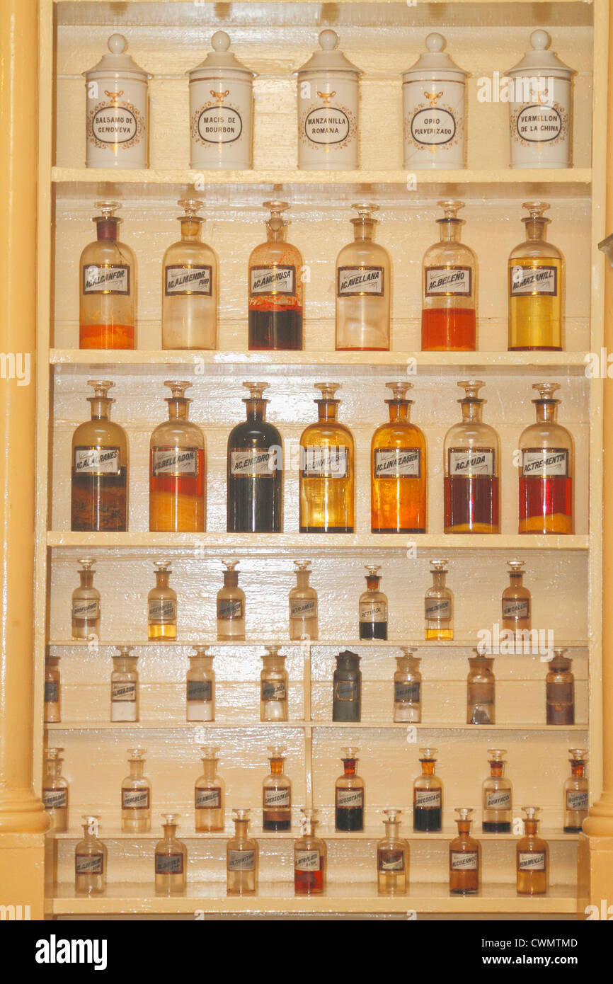 Vintage medical pharmaceutical colorful chemical bottles on the shelf ...
