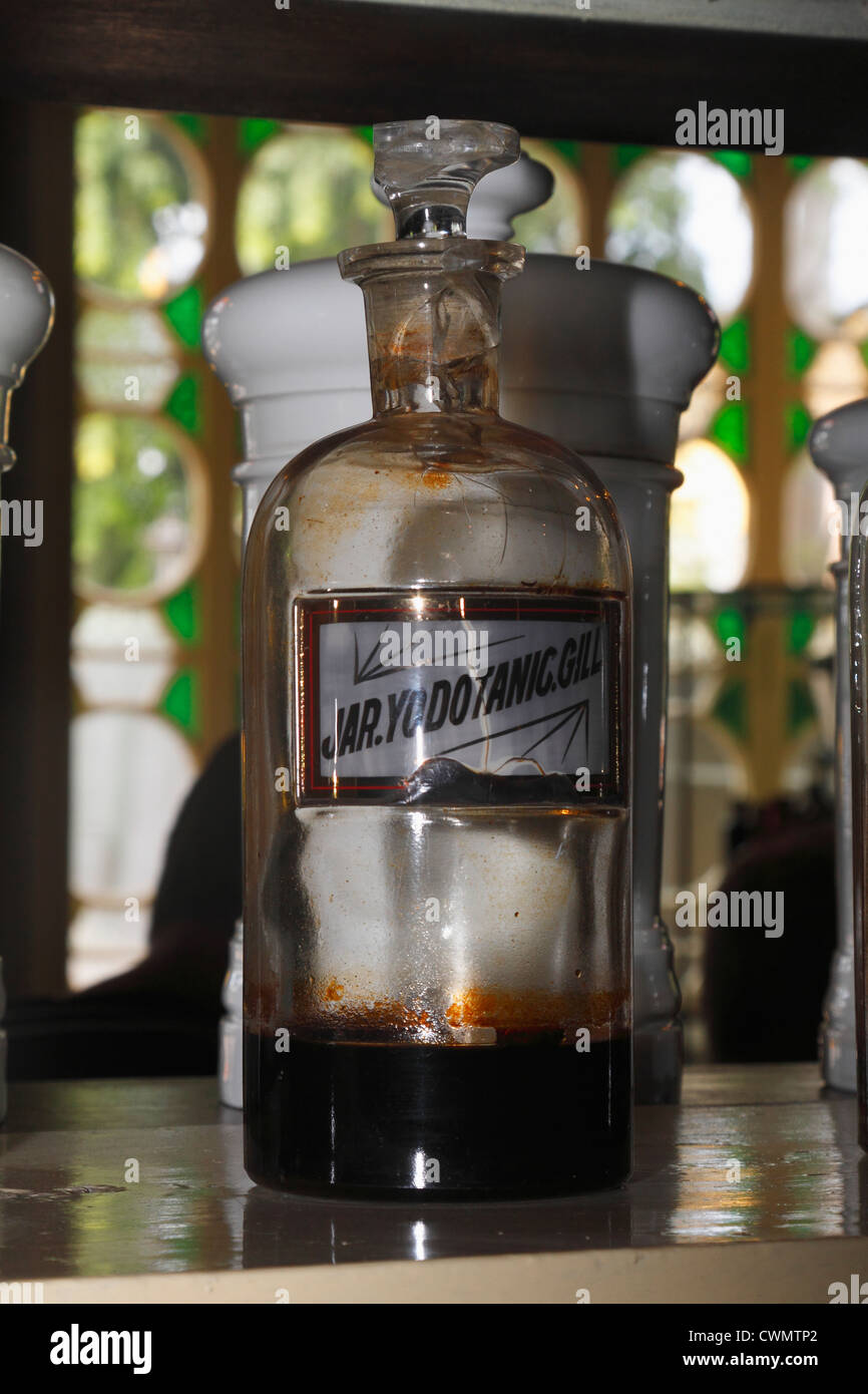 Vintage medical pharmaceutical colorful chemical bottles on the shelf ...