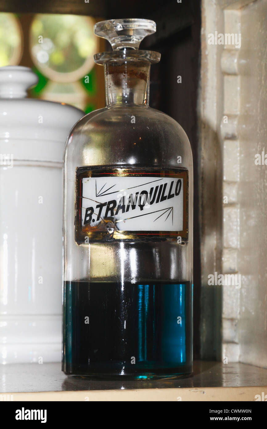 Vintage medical pharmaceutical colorful chemical bottles on the shelf ...