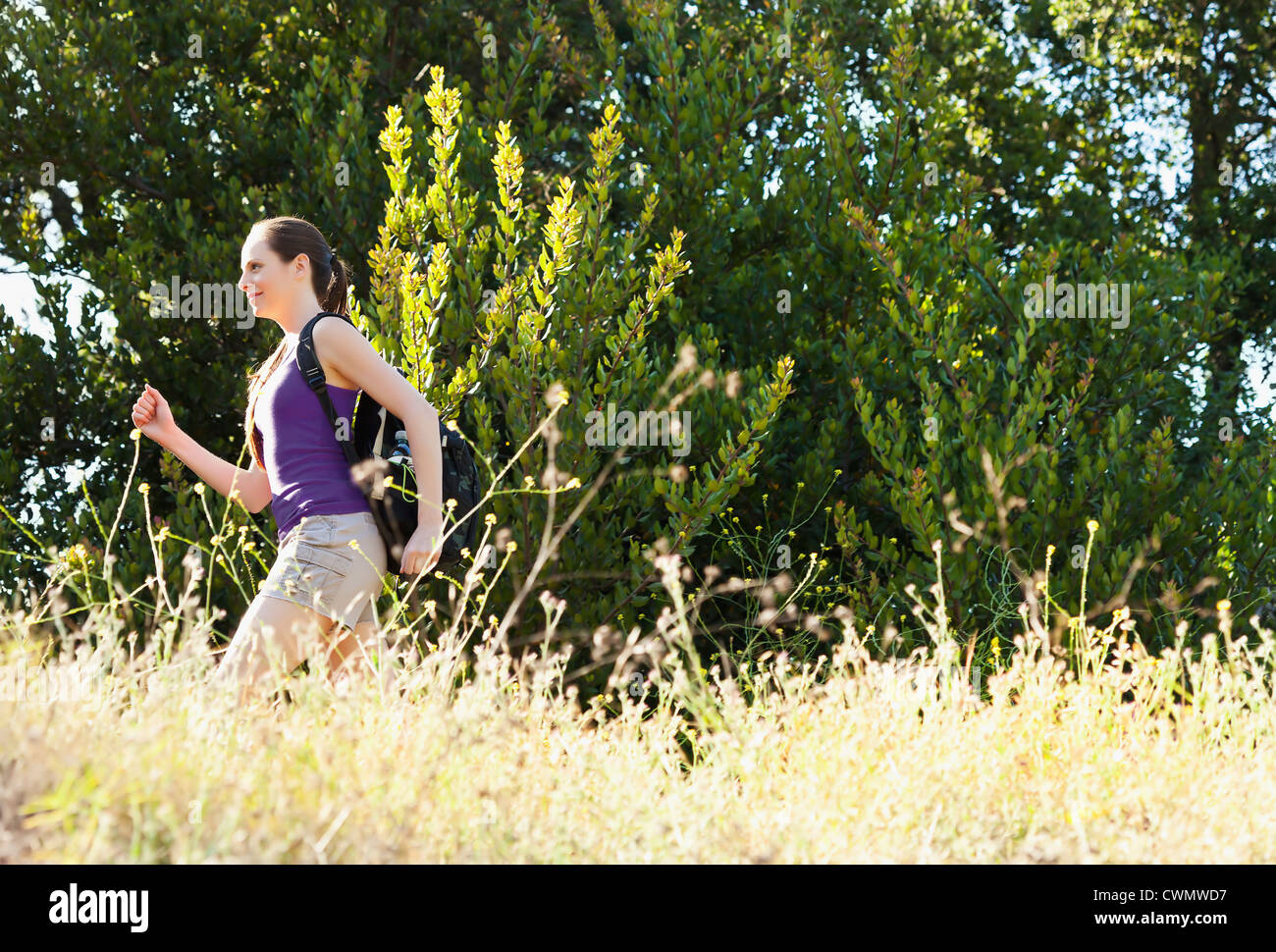 USA, California, Los Angeles, Woman running through meadow Stock Photo ...