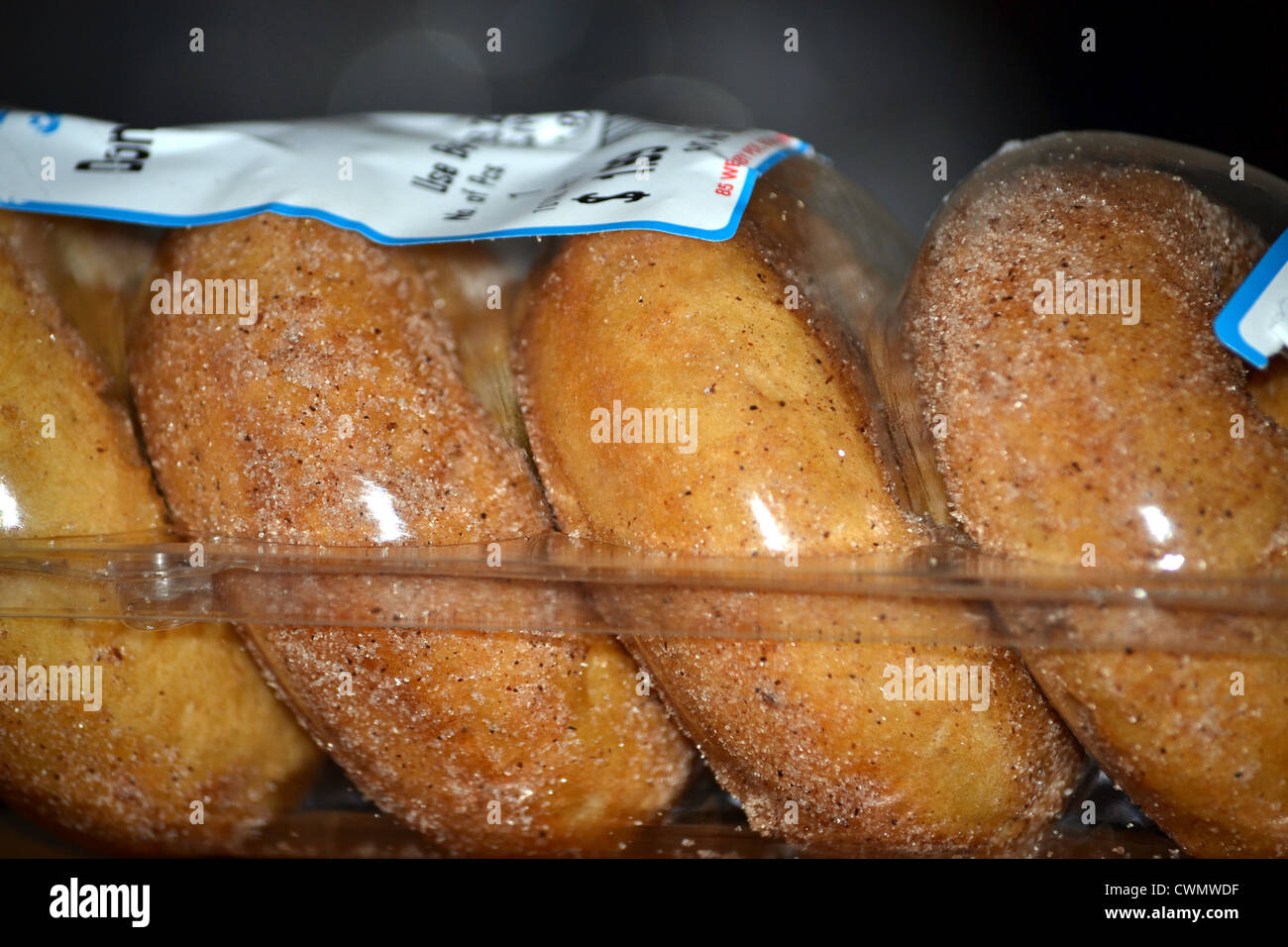 Six pack of fresh cinnamon donuts $1.99 Stock Photo - Alamy
