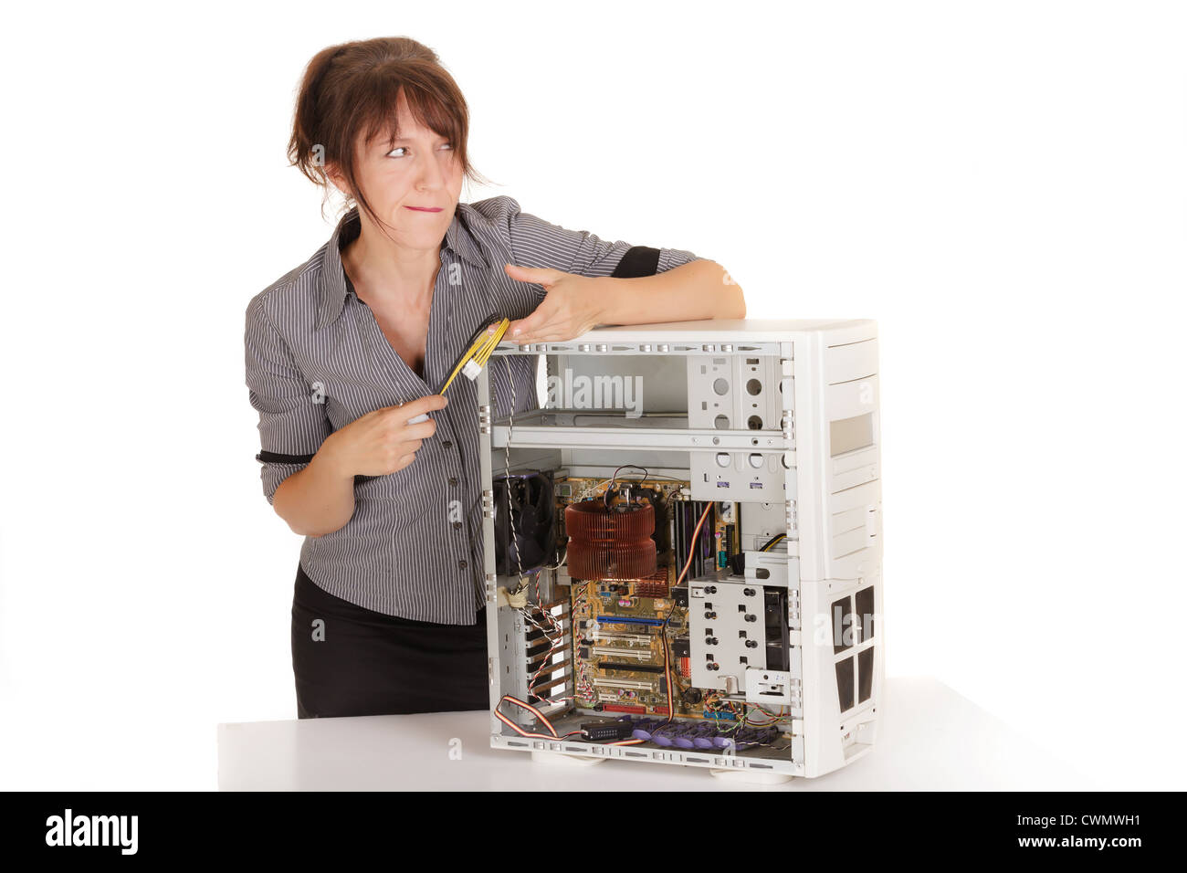 pensive woman in confusion with broken computer Stock Photo - Alamy