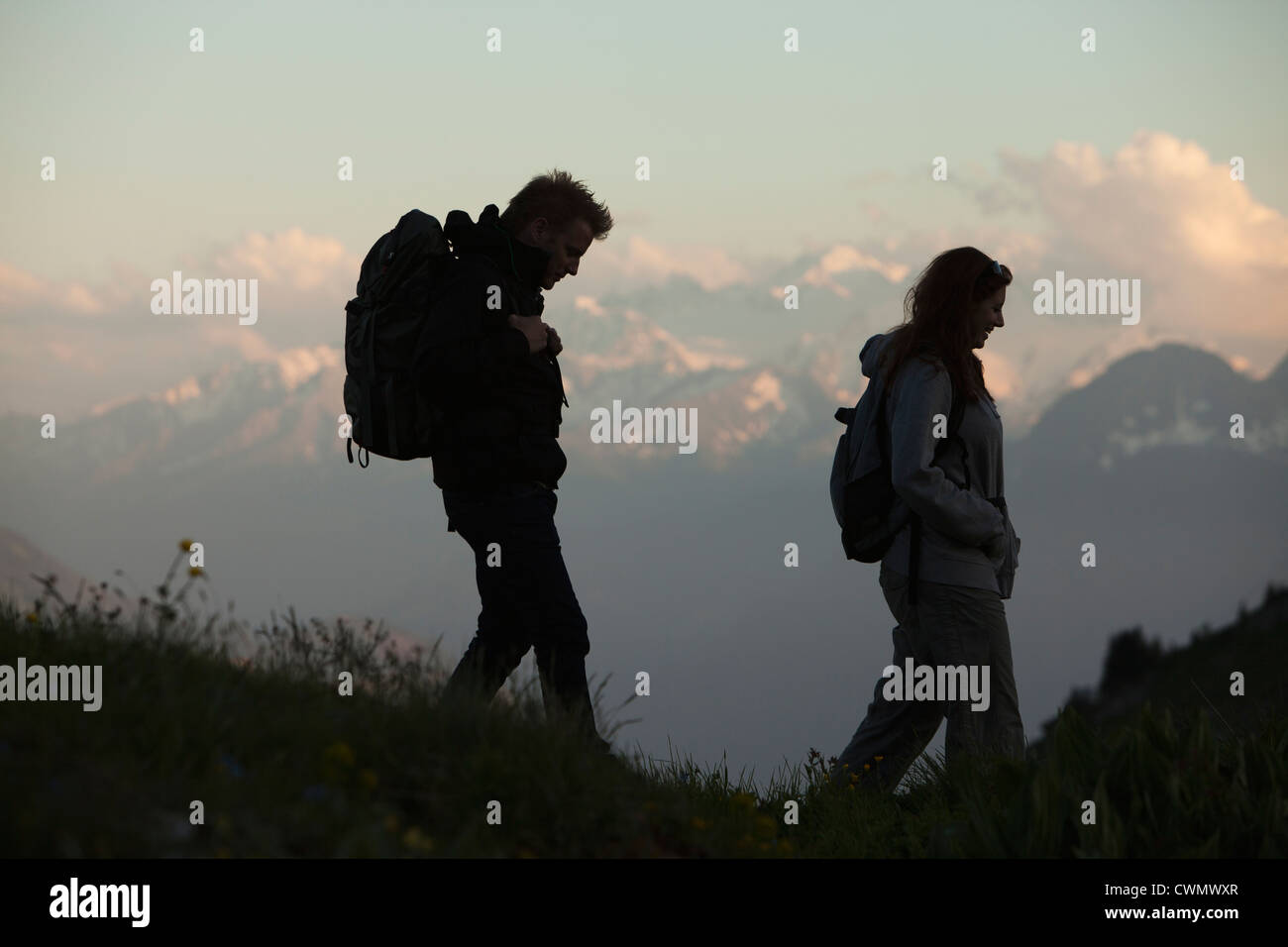 Switzerland, Leysin, Hikers marching through Alpine landscape Stock ...