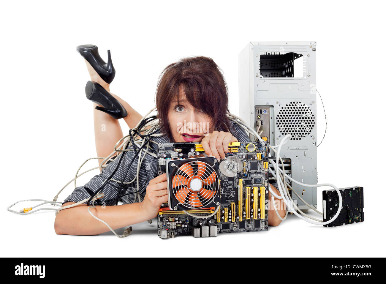 frustrated woman lying down holding computer motherboard Stock Photo ...