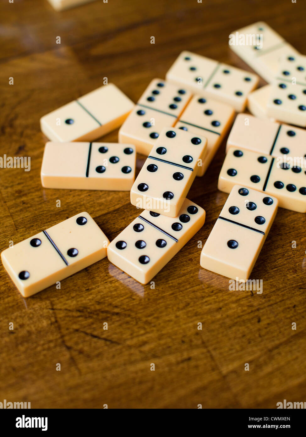 Domino tiles on wooden surface, studio shot Stock Photo - Alamy