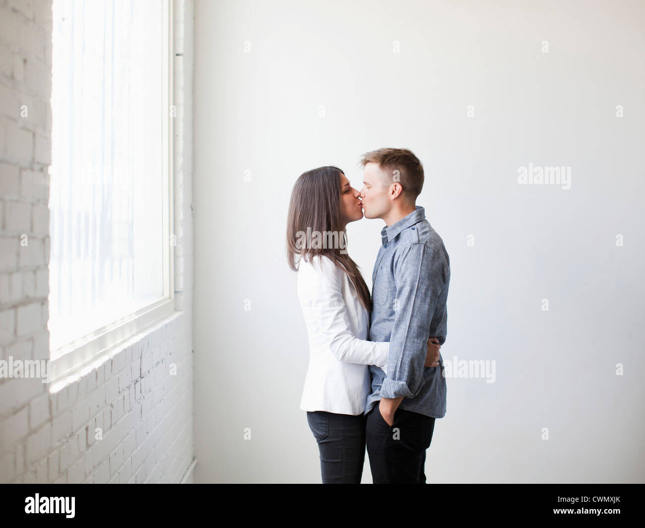 Horizontal view kissing young hi-res stock photography and images - Alamy