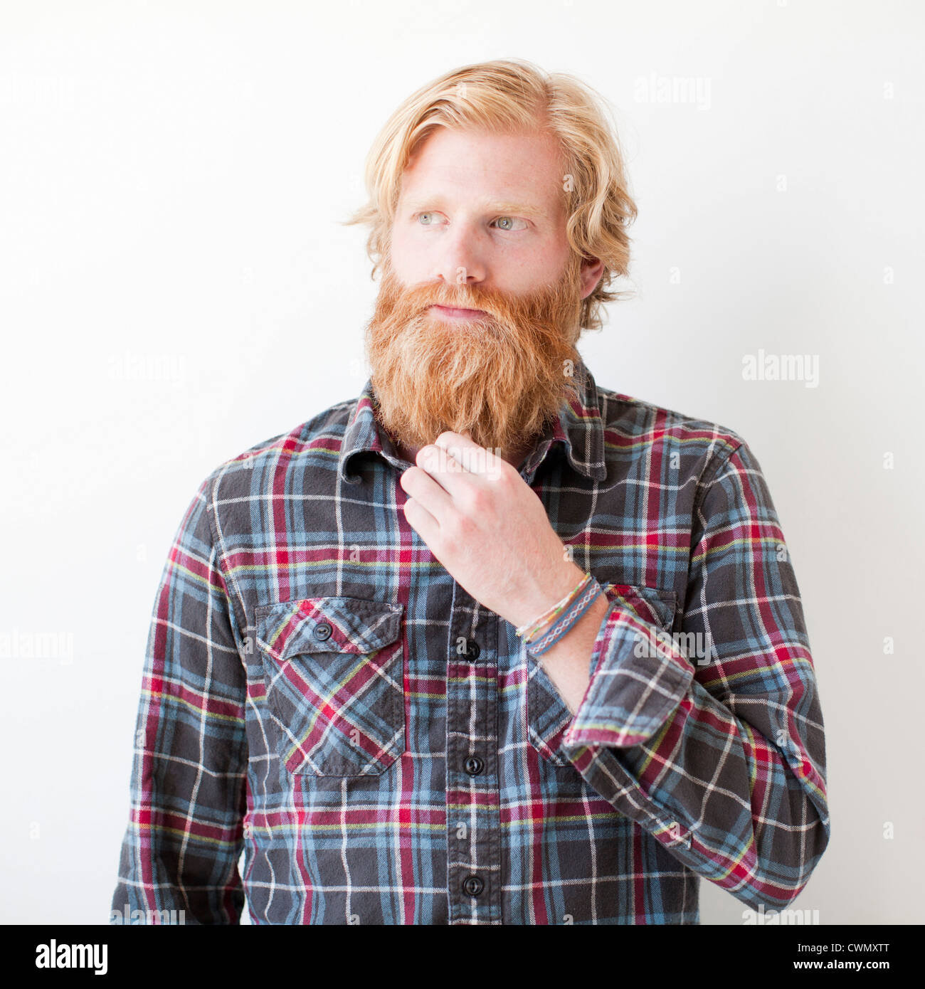 Studio portrait of man with beard Stock Photo - Alamy