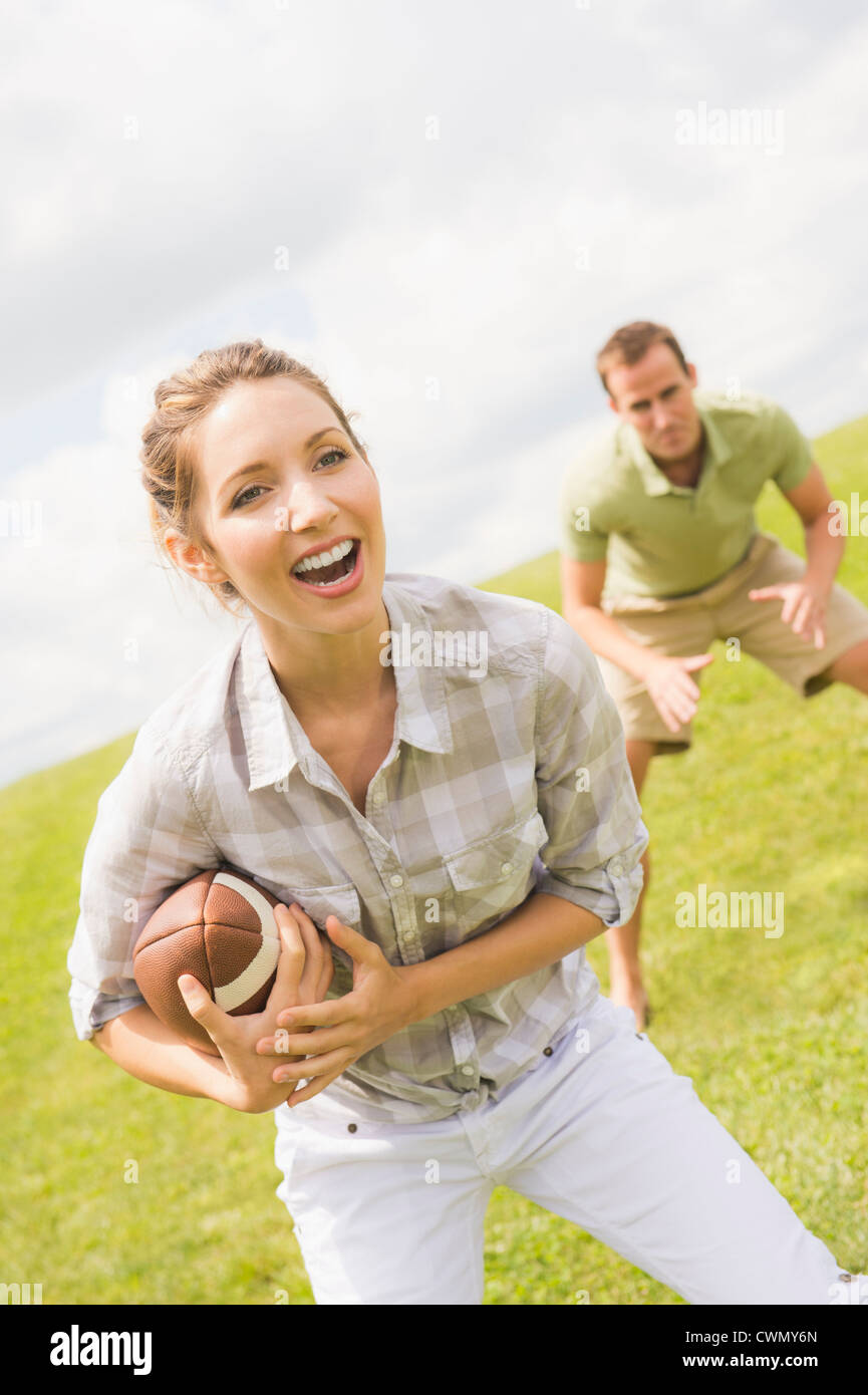 USA, New Jersey, Mendham, Couple playing with football Stock Photo - Alamy