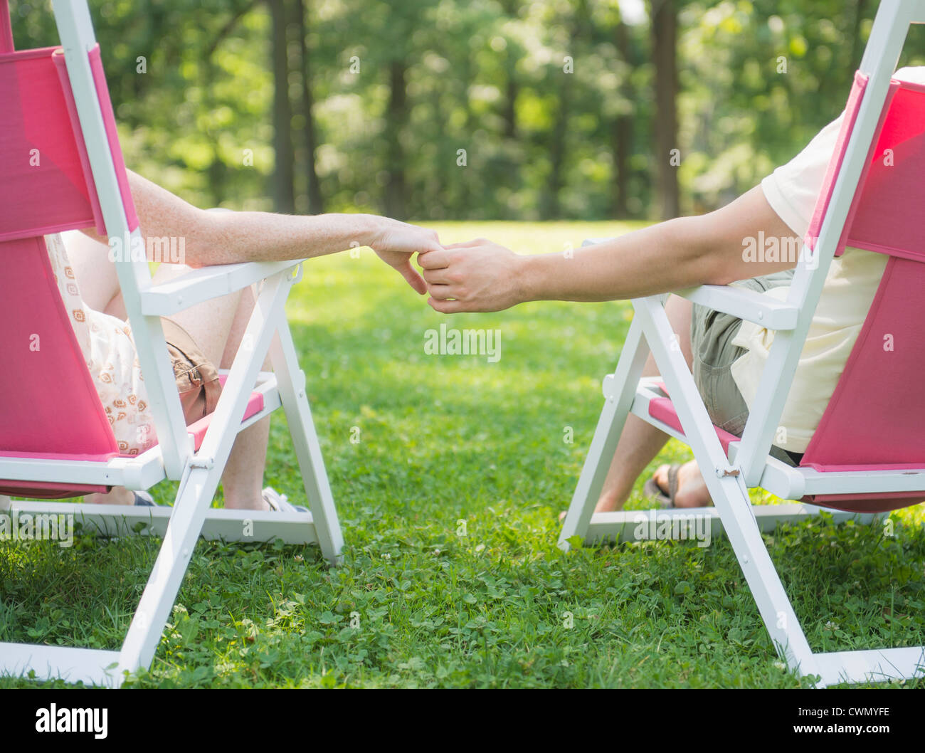 Chair holding hands rear view hi-res stock photography and images - Alamy